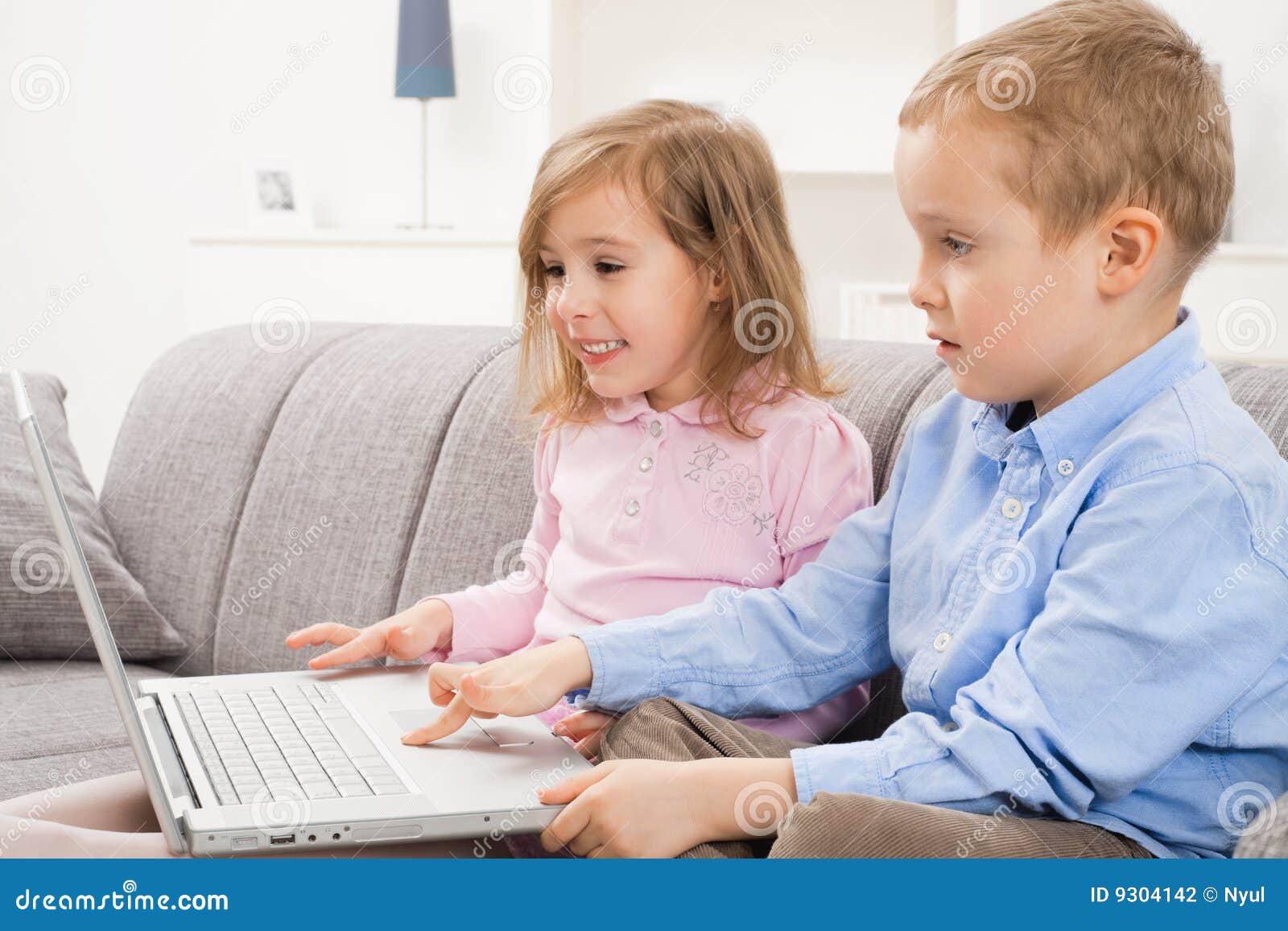 Happy children with laptop stock photo. Image of internet - 9304142