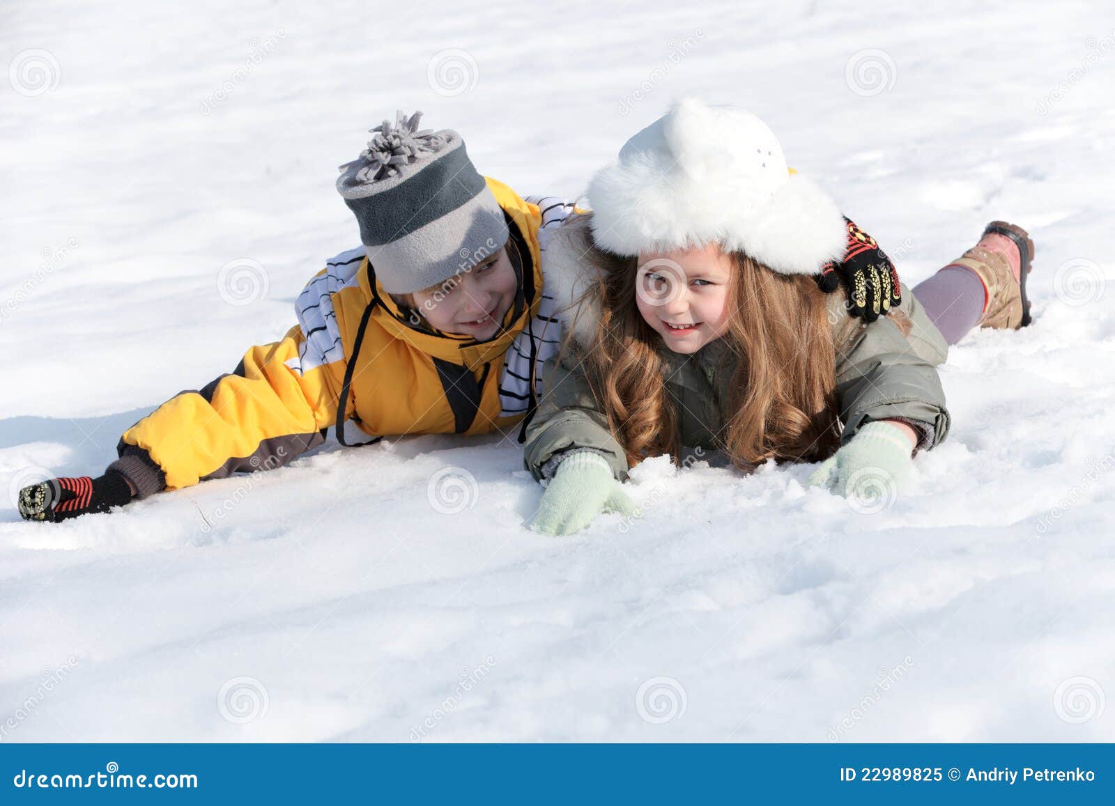 Happy Children Laying Down in the Snow Stock Image - Image of clothing ...