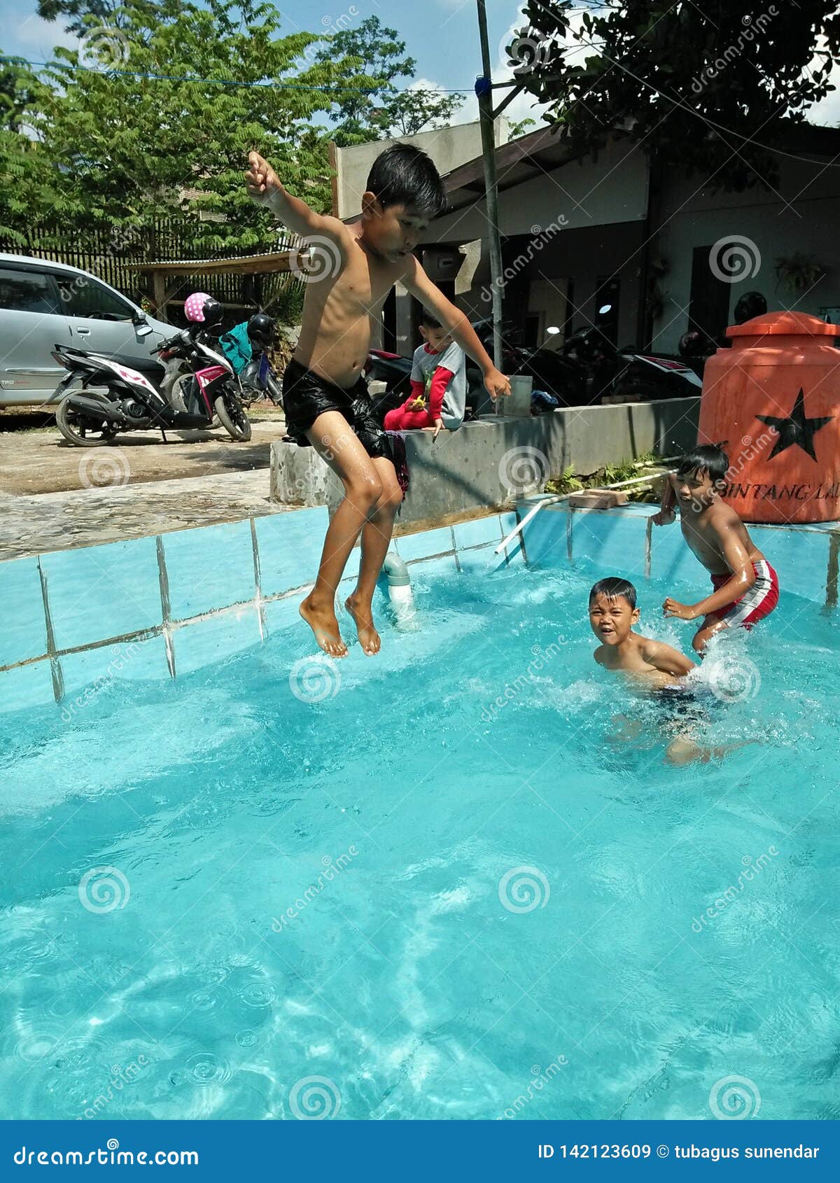 Three Children in Mini Pool at the Backyard Editorial Stock Image ...
