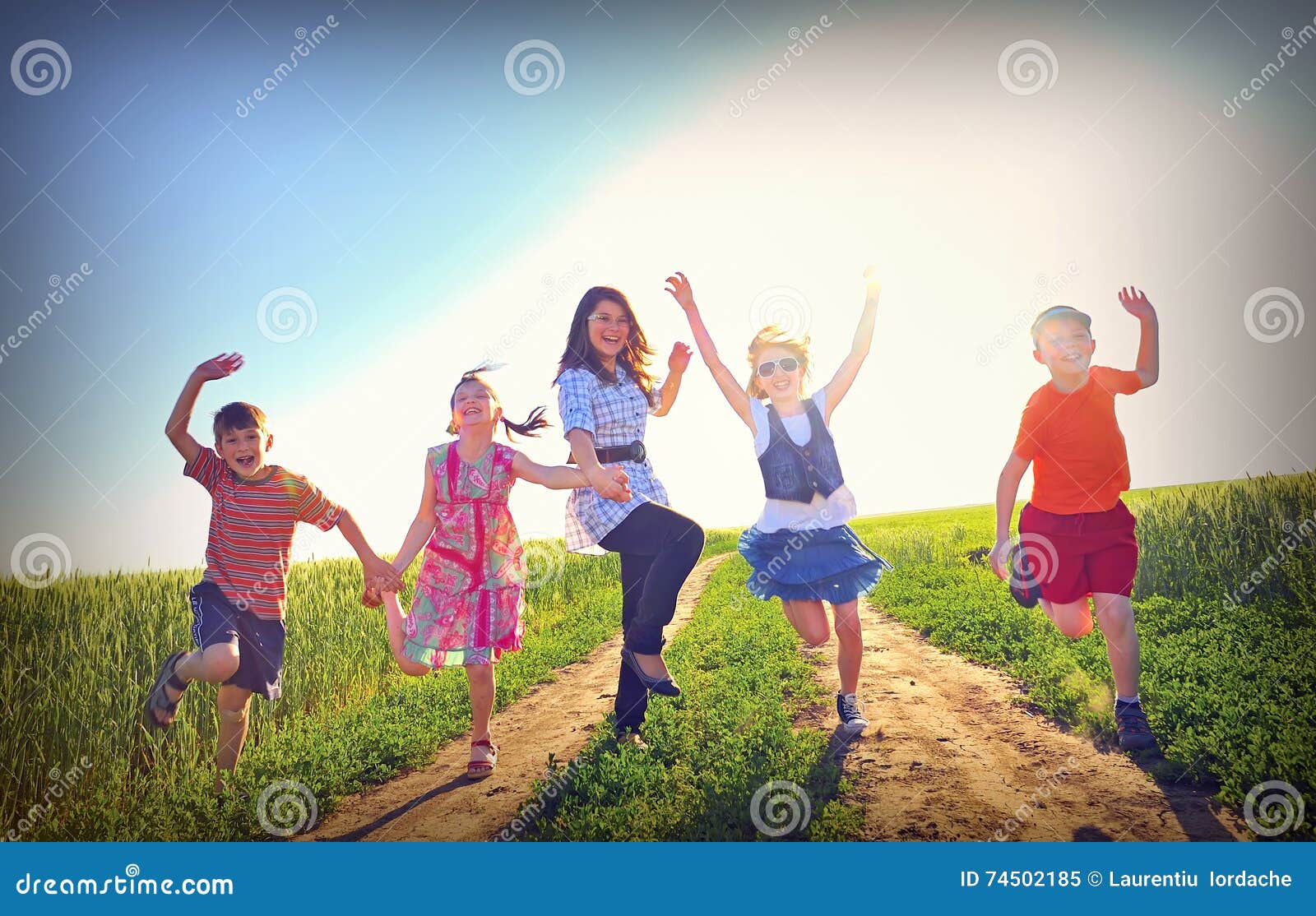Happy Children Play on Field Stock Image - Image of caucasian, laughing ...