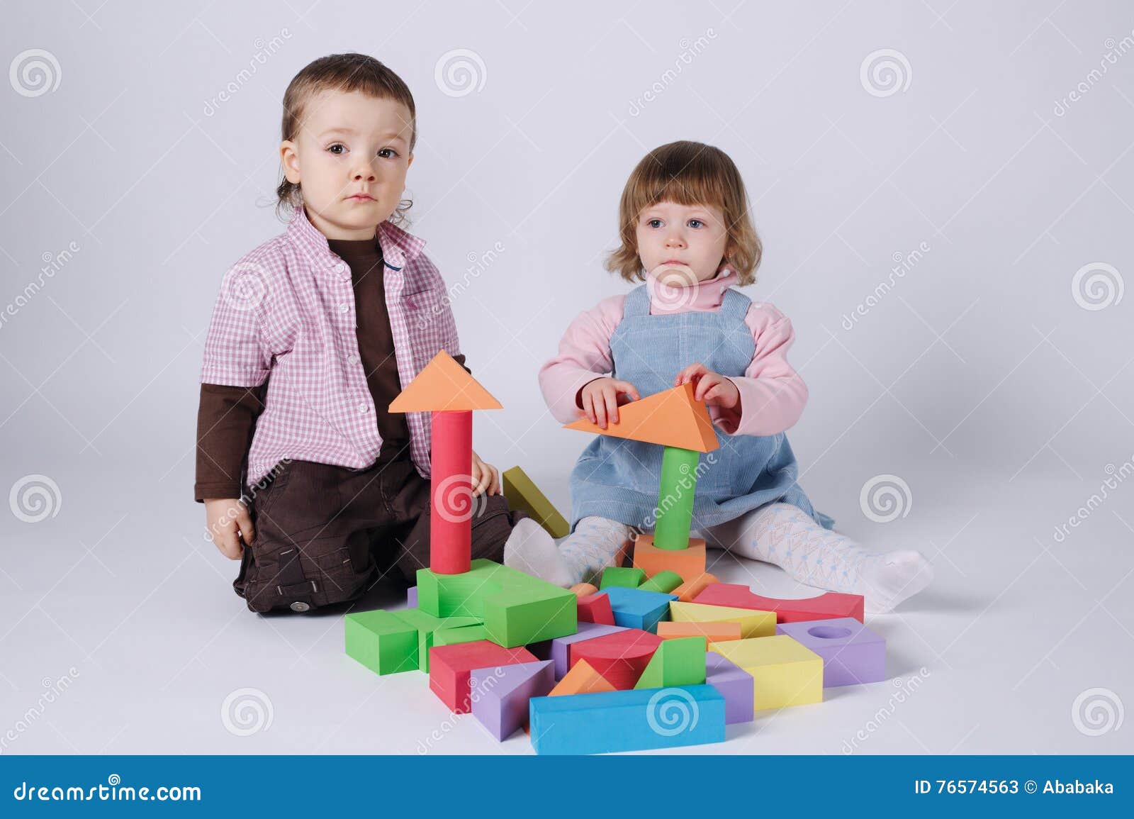 Happy Children Playing With Cubes Stock Image | CartoonDealer.com #76574563