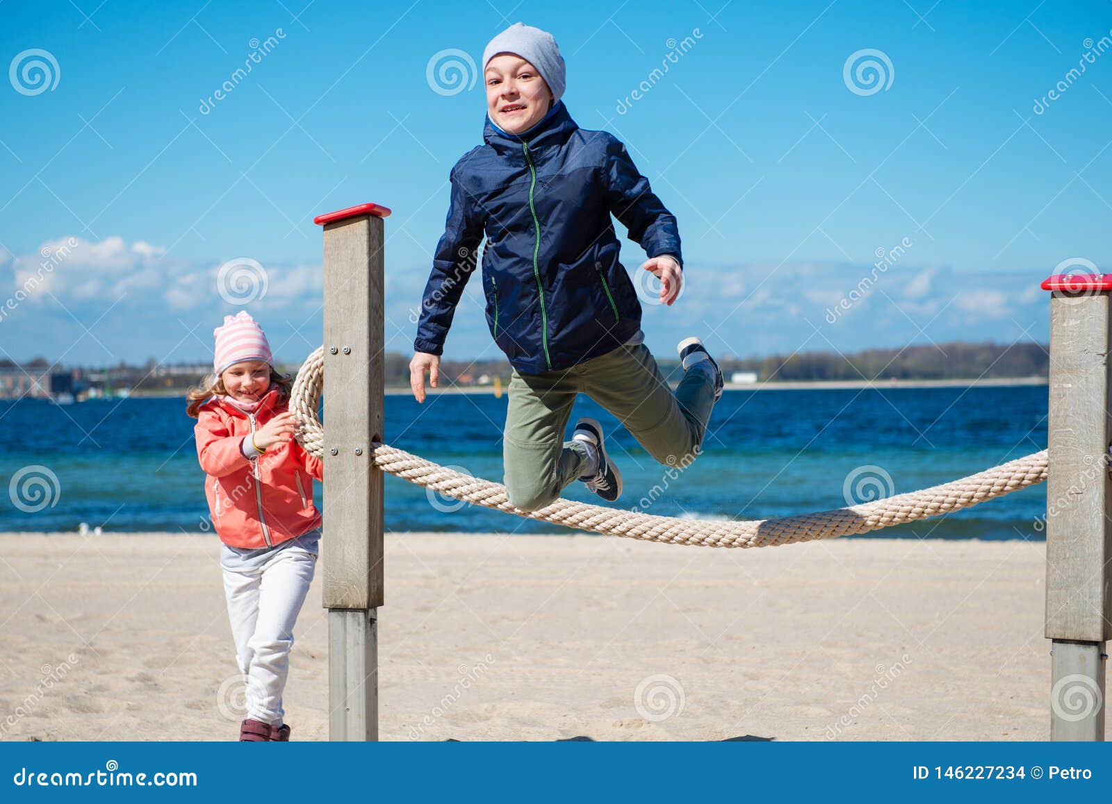Happy Children Playing at Playground on a Beach Stock Photo - Image of ...