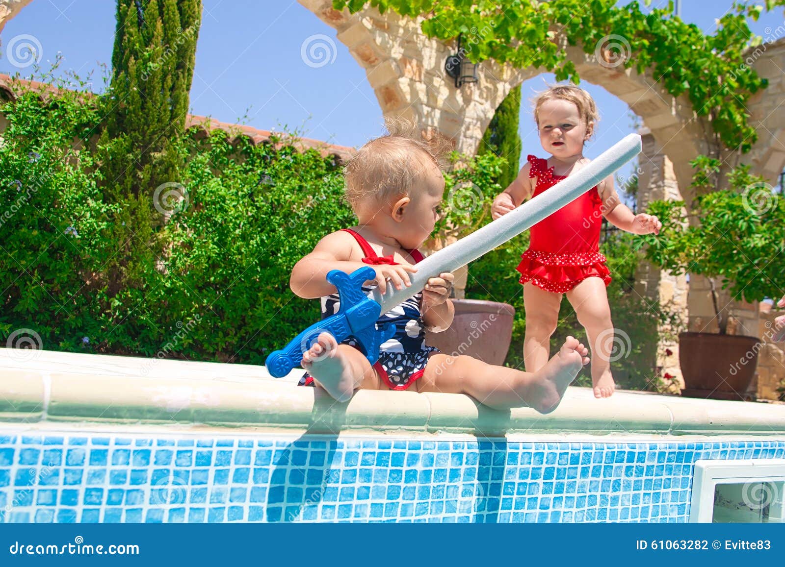 Happy Children Playing in the Pool Stock Photo - Image of blue, friends ...