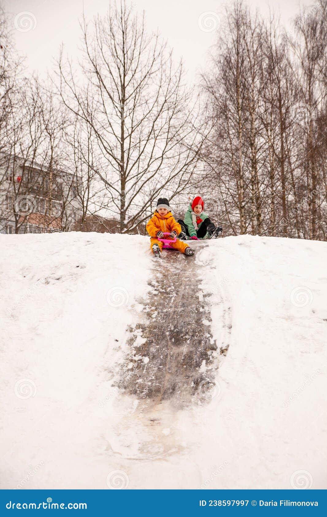 Happy Children Riding Down Ice Slide Stock Image - Image of hugging ...