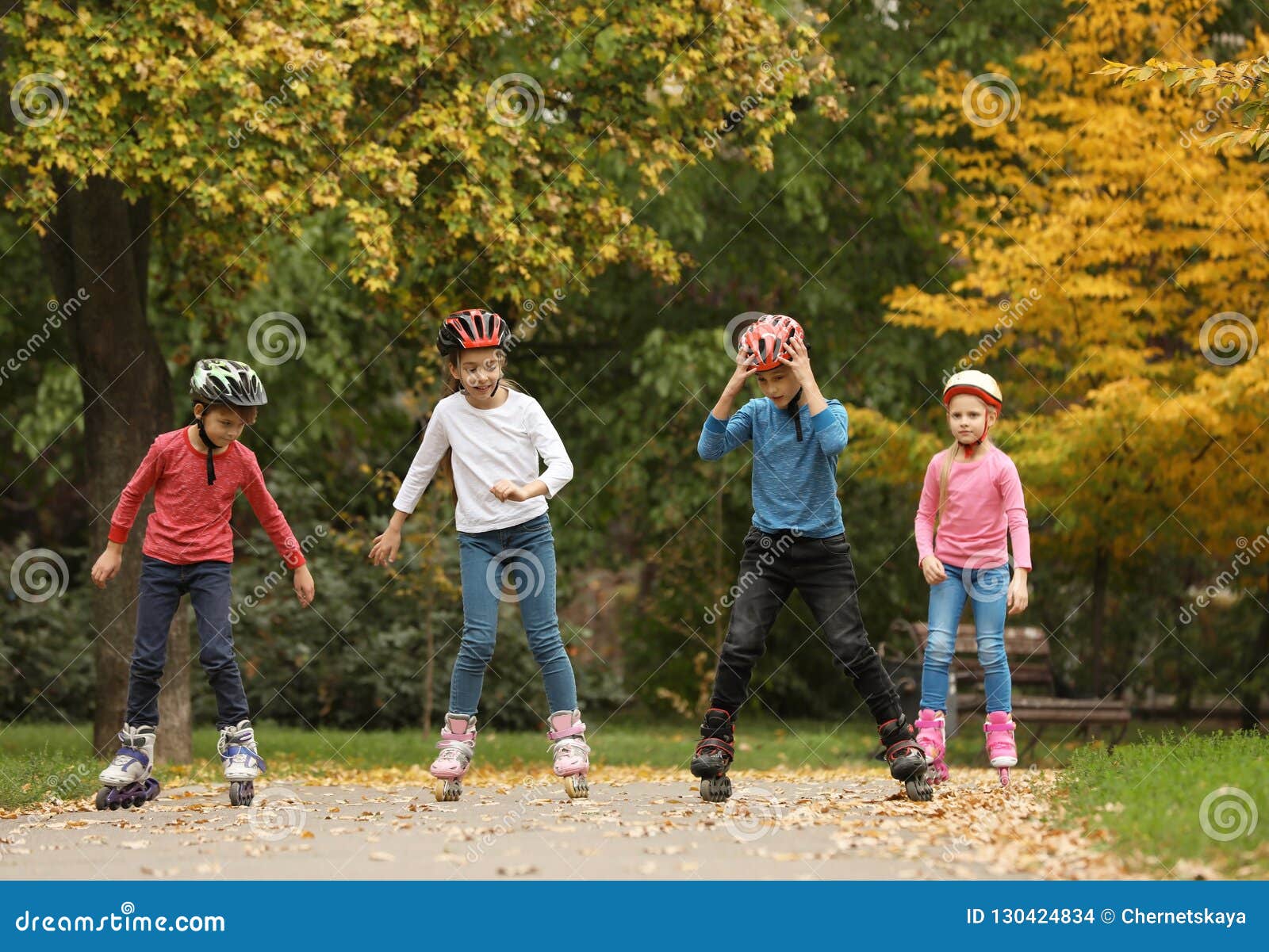 Happy Children Roller Skating in Park Stock Photo - Image of kids ...