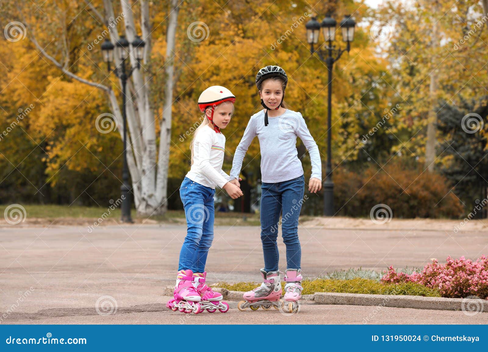 Happy Children Roller Skating Stock Photo - Image of fall, game: 131950024