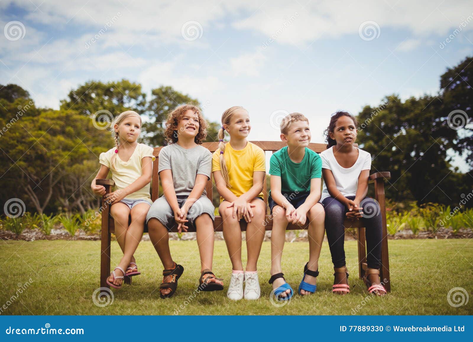 Happy Children Sitting on a Bench Stock Photo - Image of casual ...