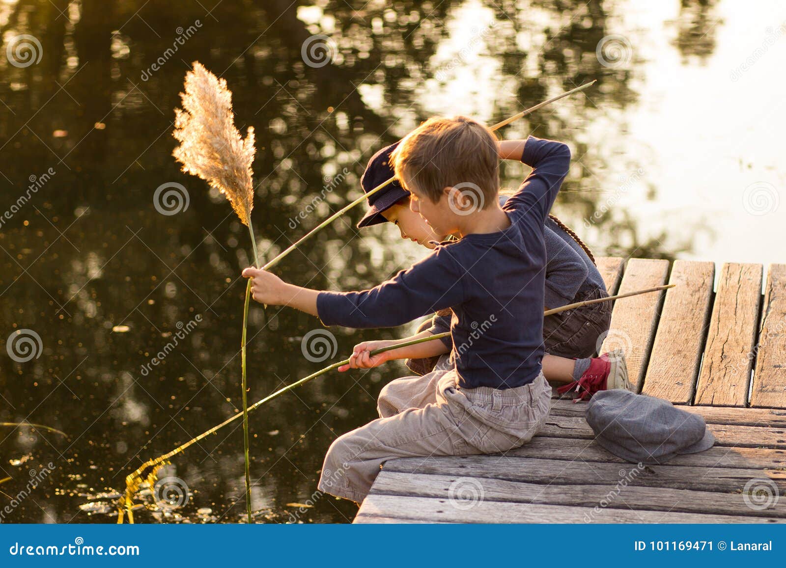 Happy Children Sitting with Sticks in Hands Stock Image - Image of ...
