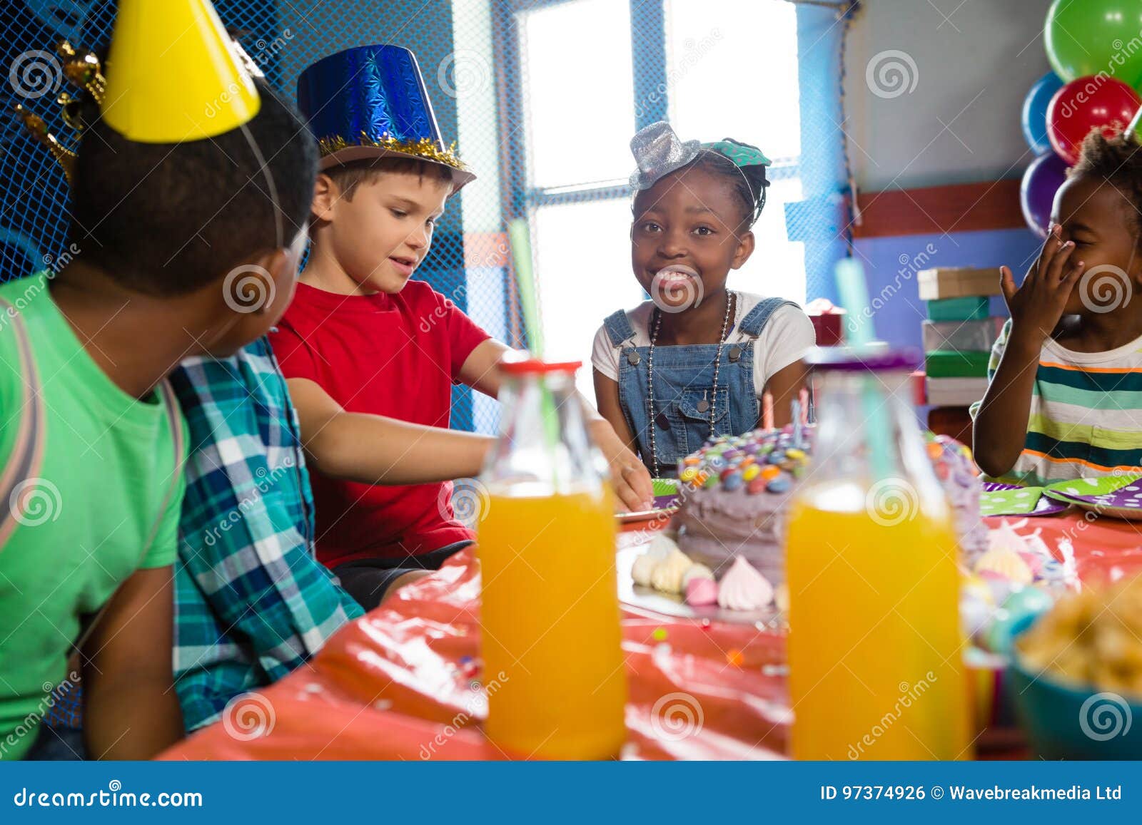 Happy Children Sitting at Table Stock Photo - Image of child, multi ...