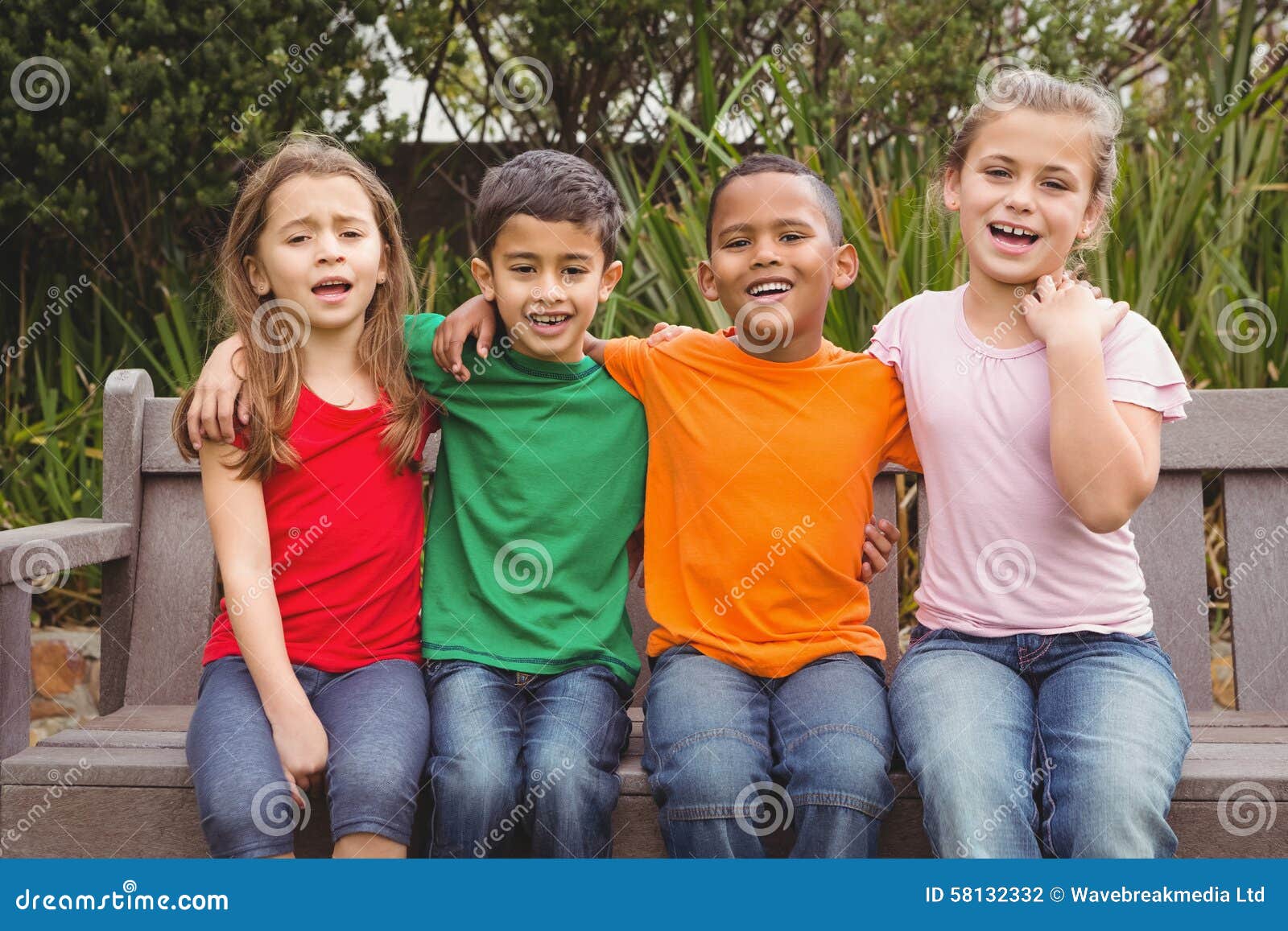 Happy Children Sitting Together on a Bench Stock Photo - Image of green ...