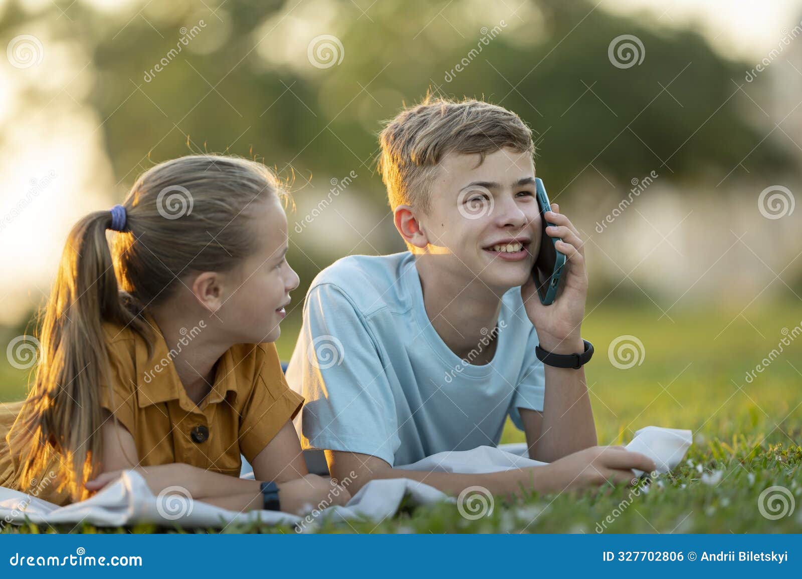 Happy Children Talking on Cellphone in Summer Park. Stock Photo - Image ...