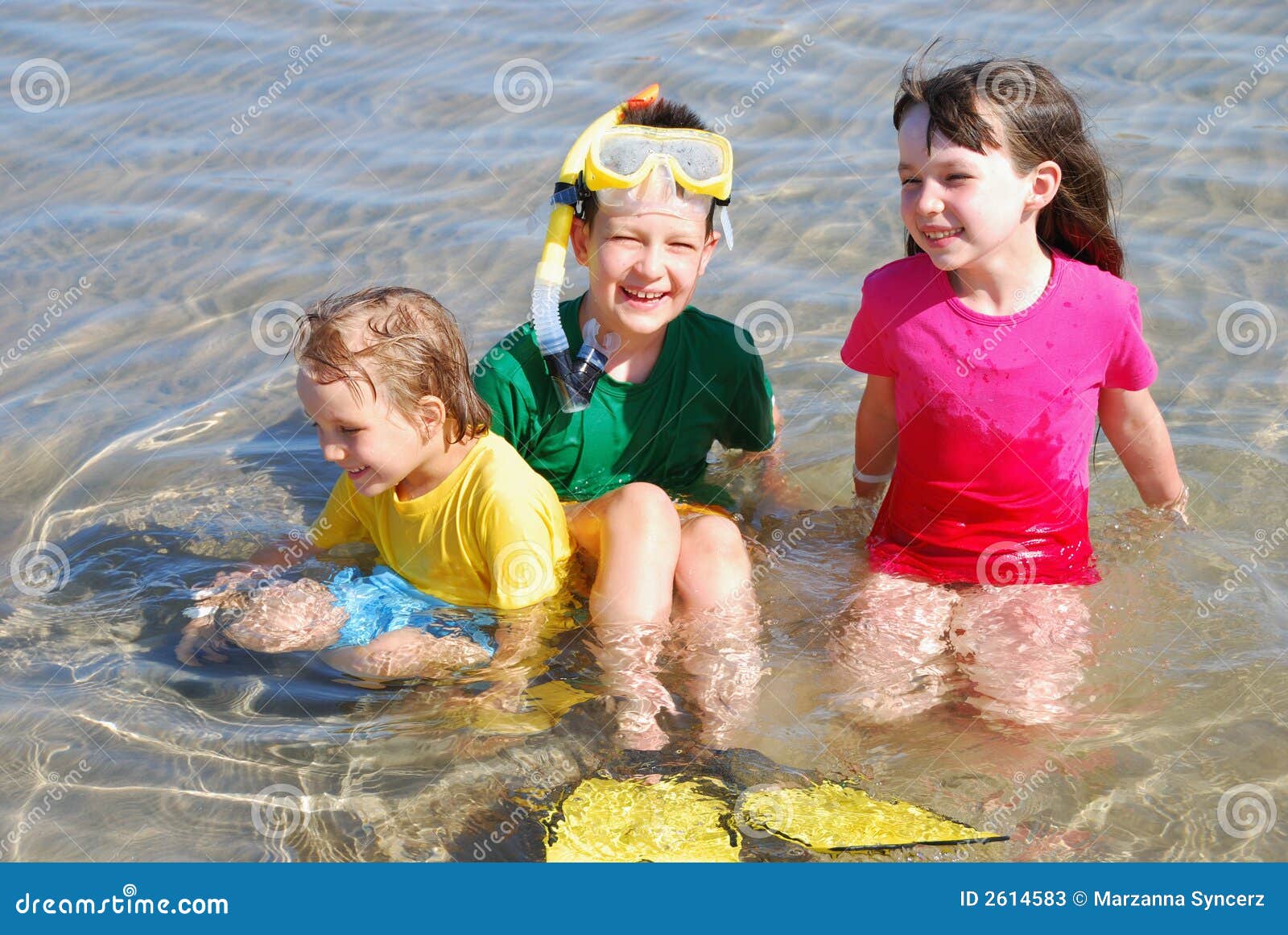 Happy children in water stock image. Image of playful - 2614583