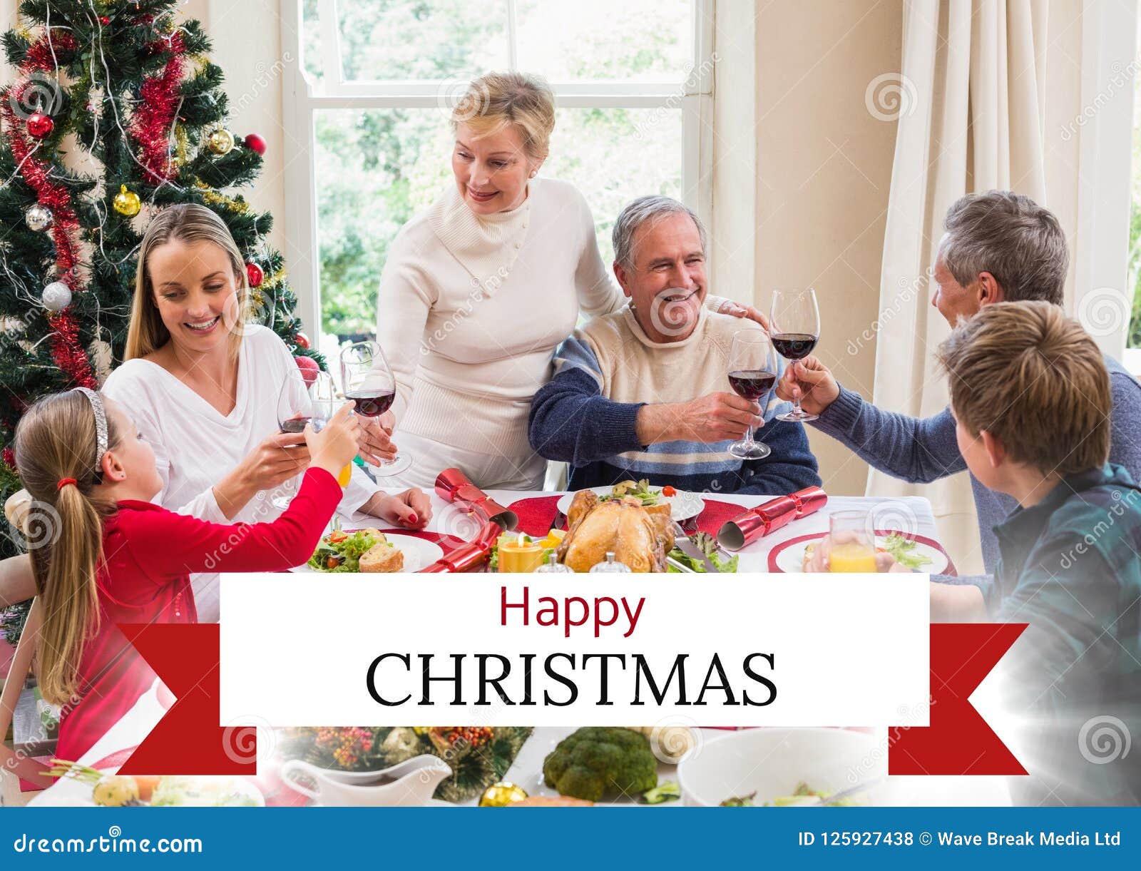 Happy Christmas Text with Family Dinner Stock Photo - Image of ...