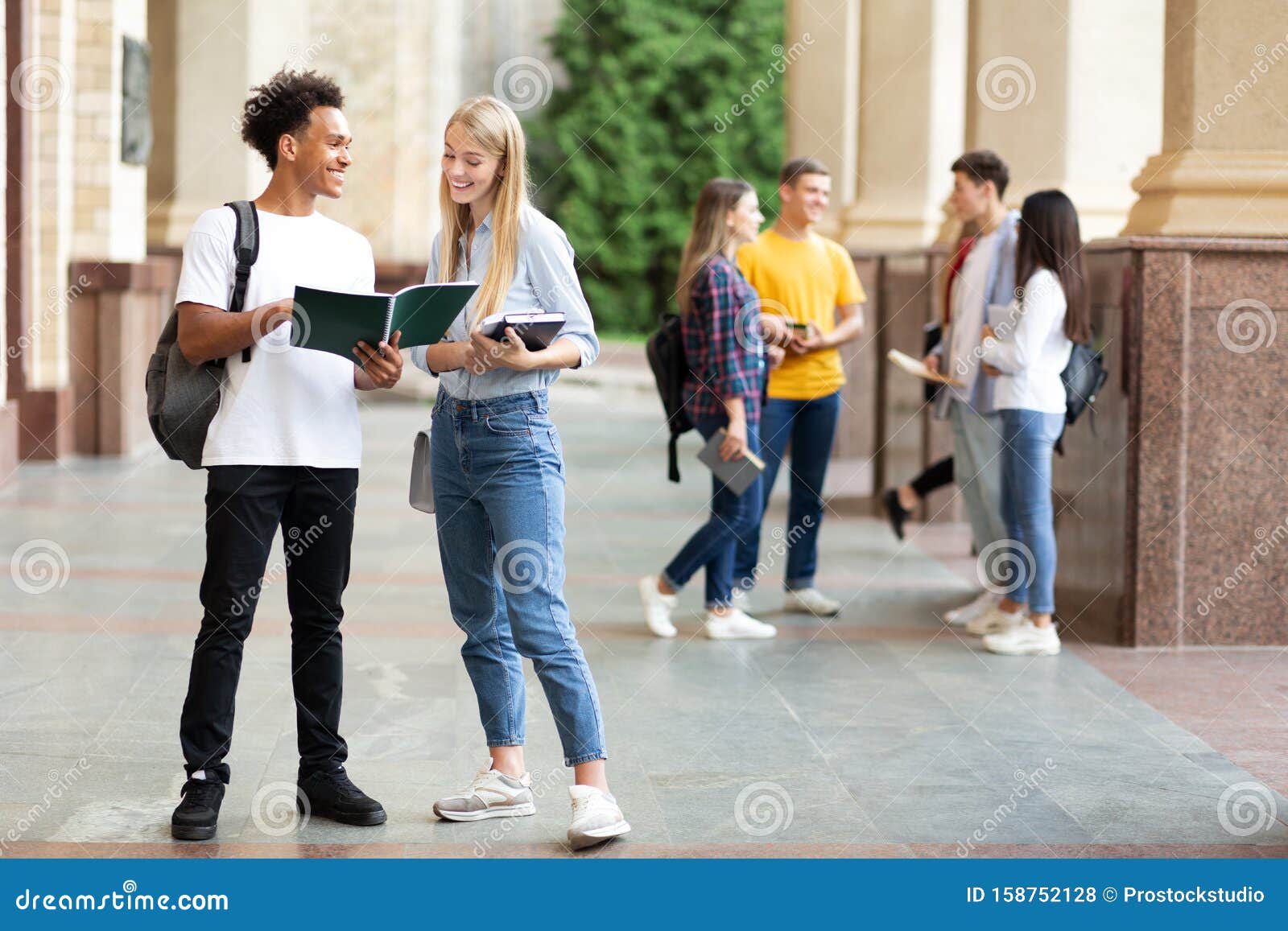 Happy Classmates Preparing for Lecture in University Campus Stock Photo ...