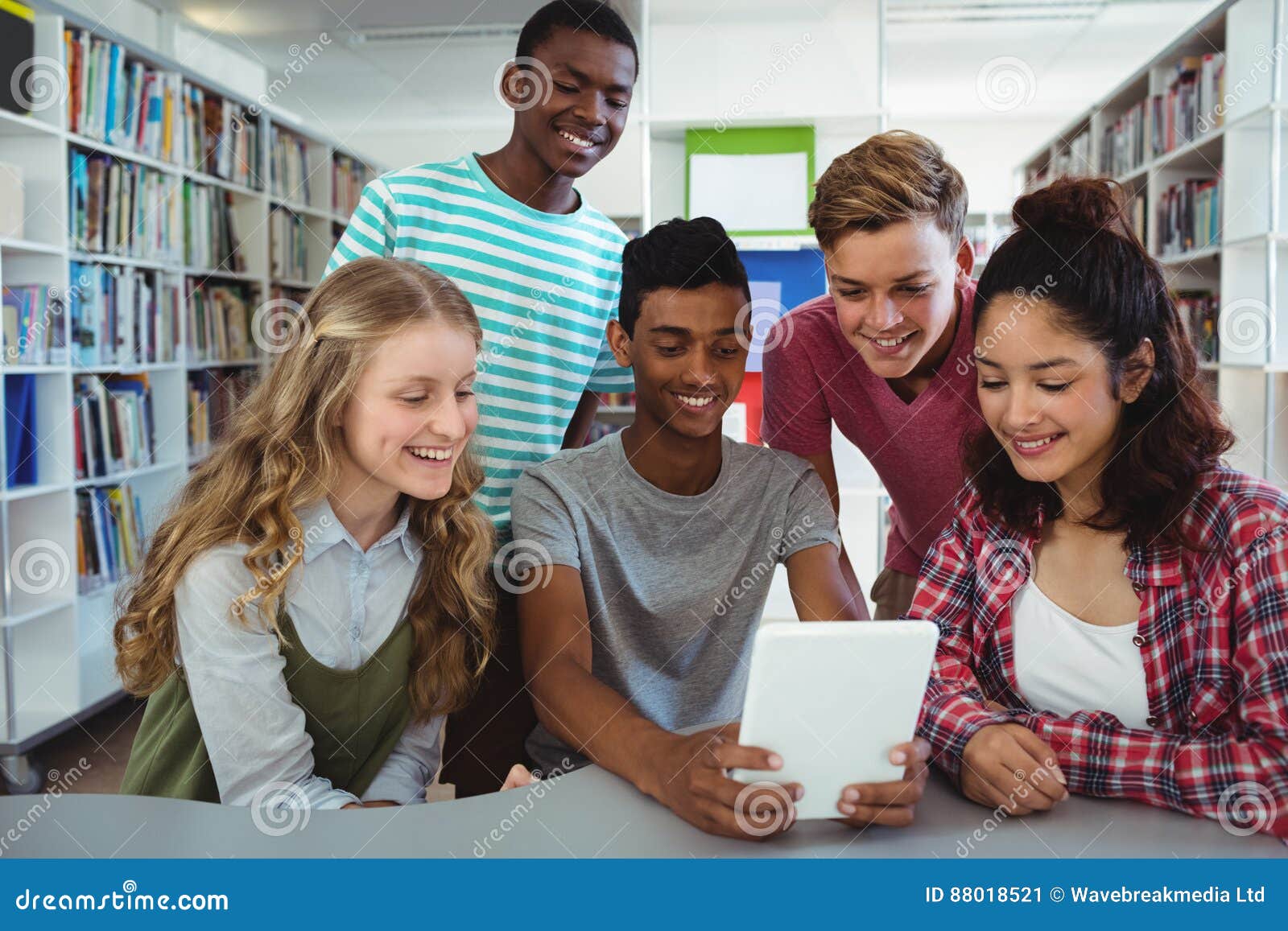 Happy Classmates Using Digital Tablet in Library Stock Image - Image of ...