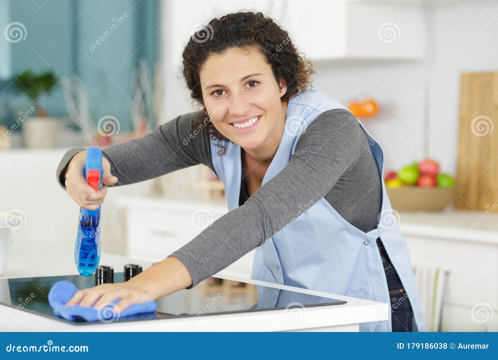 Happy cleaner at home stock photo. Image of shirt, european - 179186038