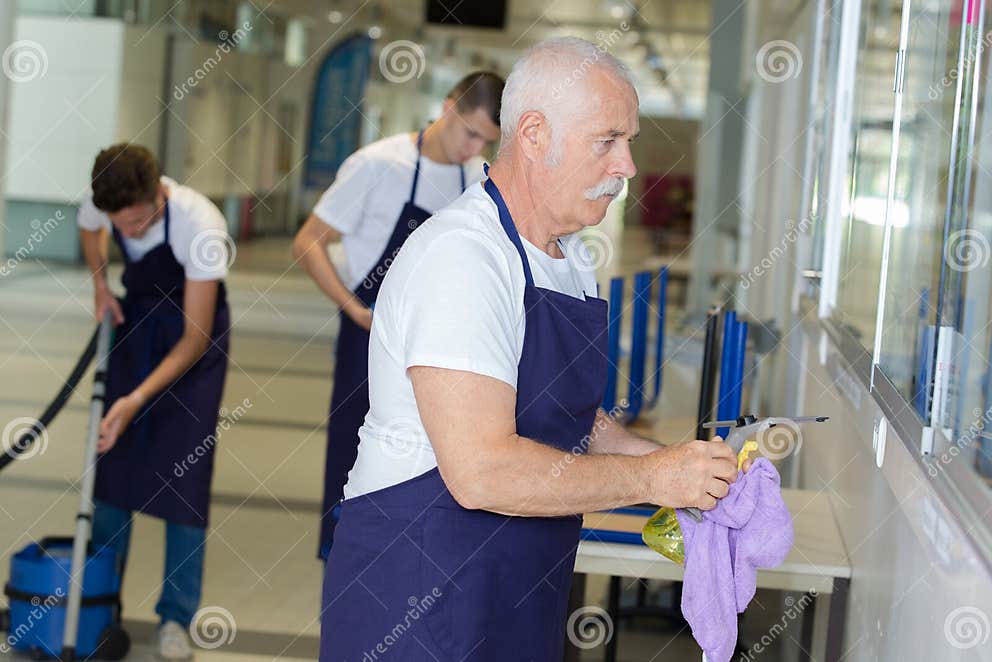 Happy Cleaners Team at Work Stock Photo - Image of uniform, people ...