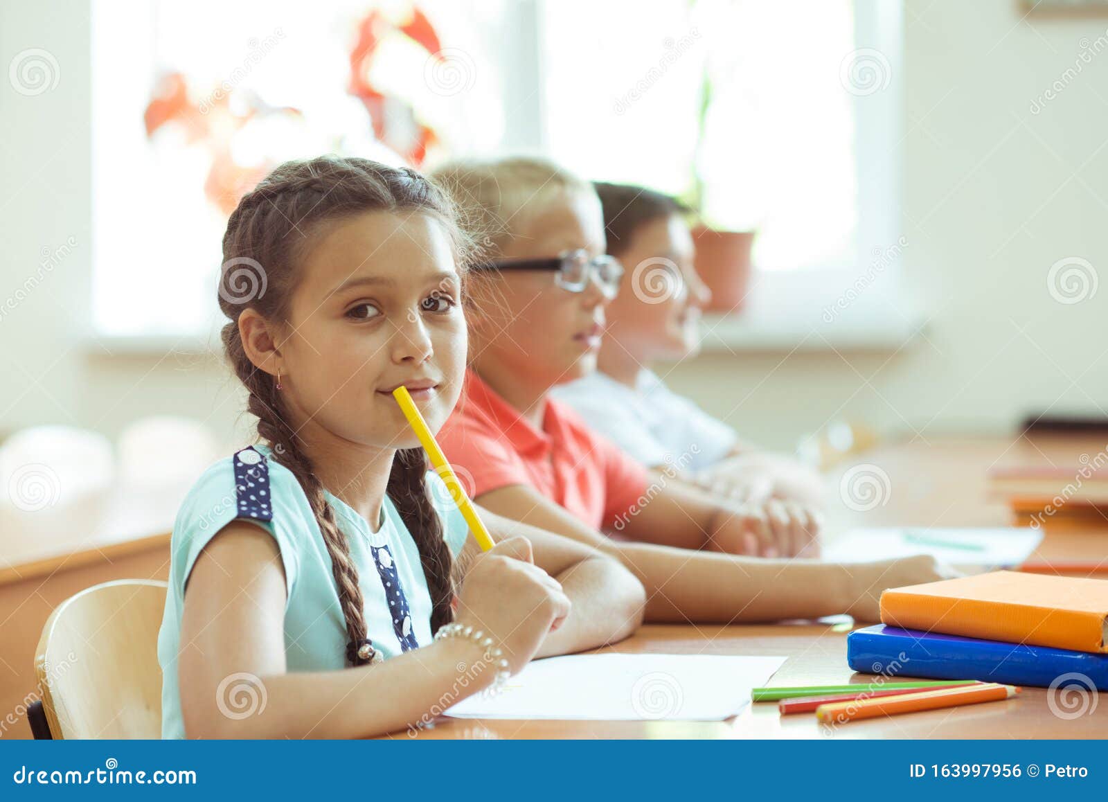 Children Learning In Classroom. Schoolteacher Explaining Lesson For ...