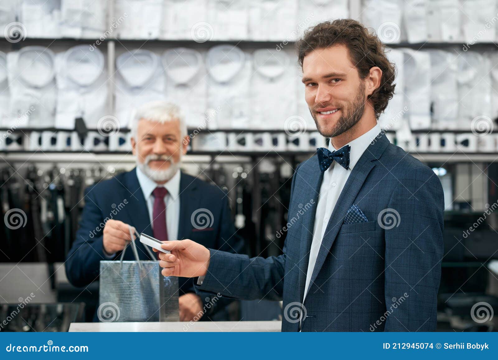 Happy Client Making Purchase and Calculated by Card. Stock Photo ...