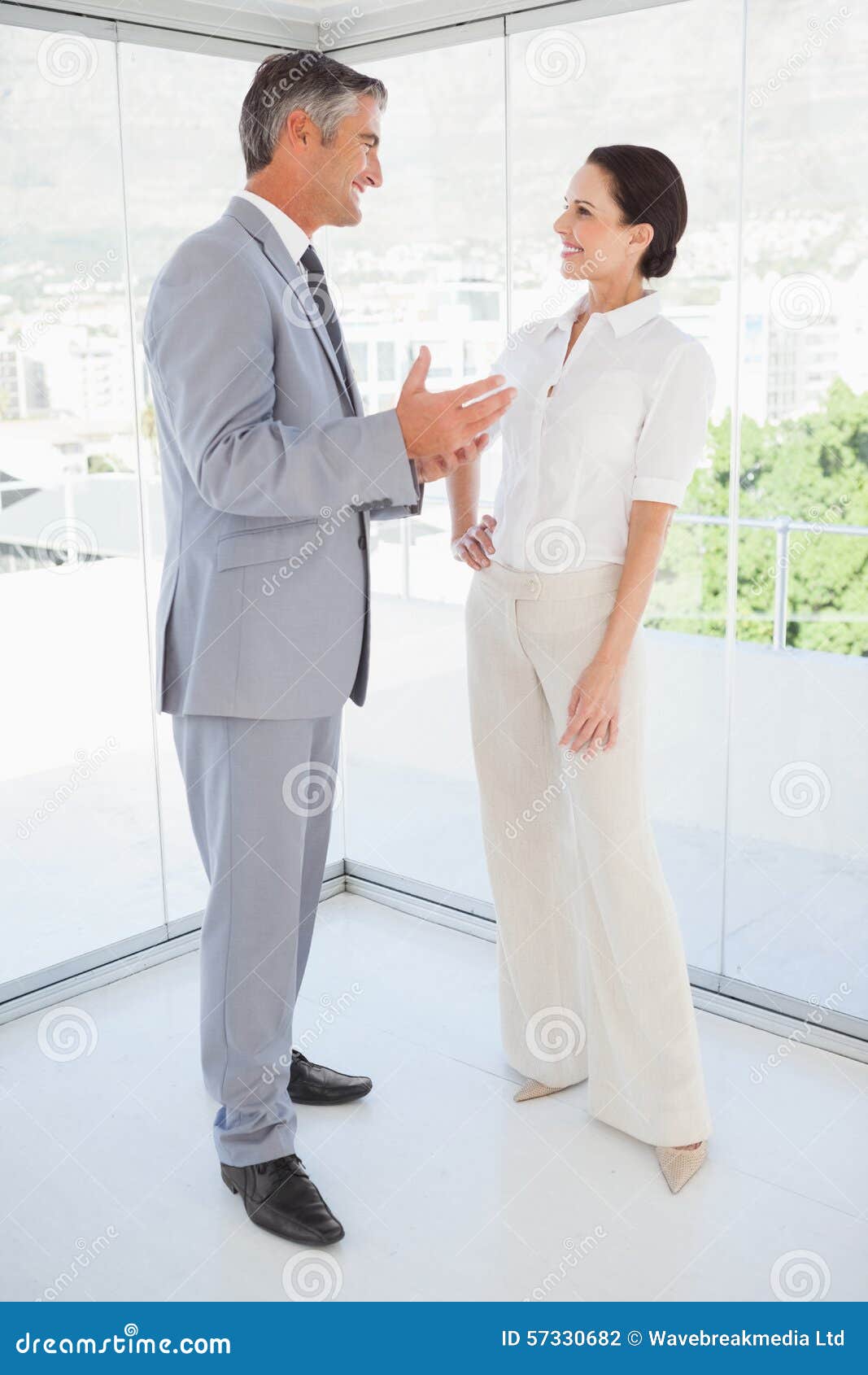 Happy Co Workers Having a Discussion Stock Photo - Image of partners ...