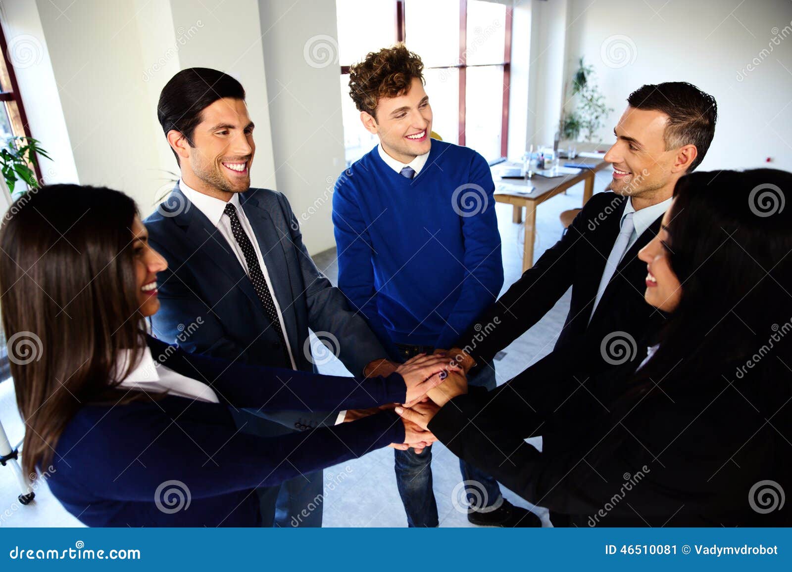 Happy Co-workers Making Pile of Hands Stock Image - Image of ...