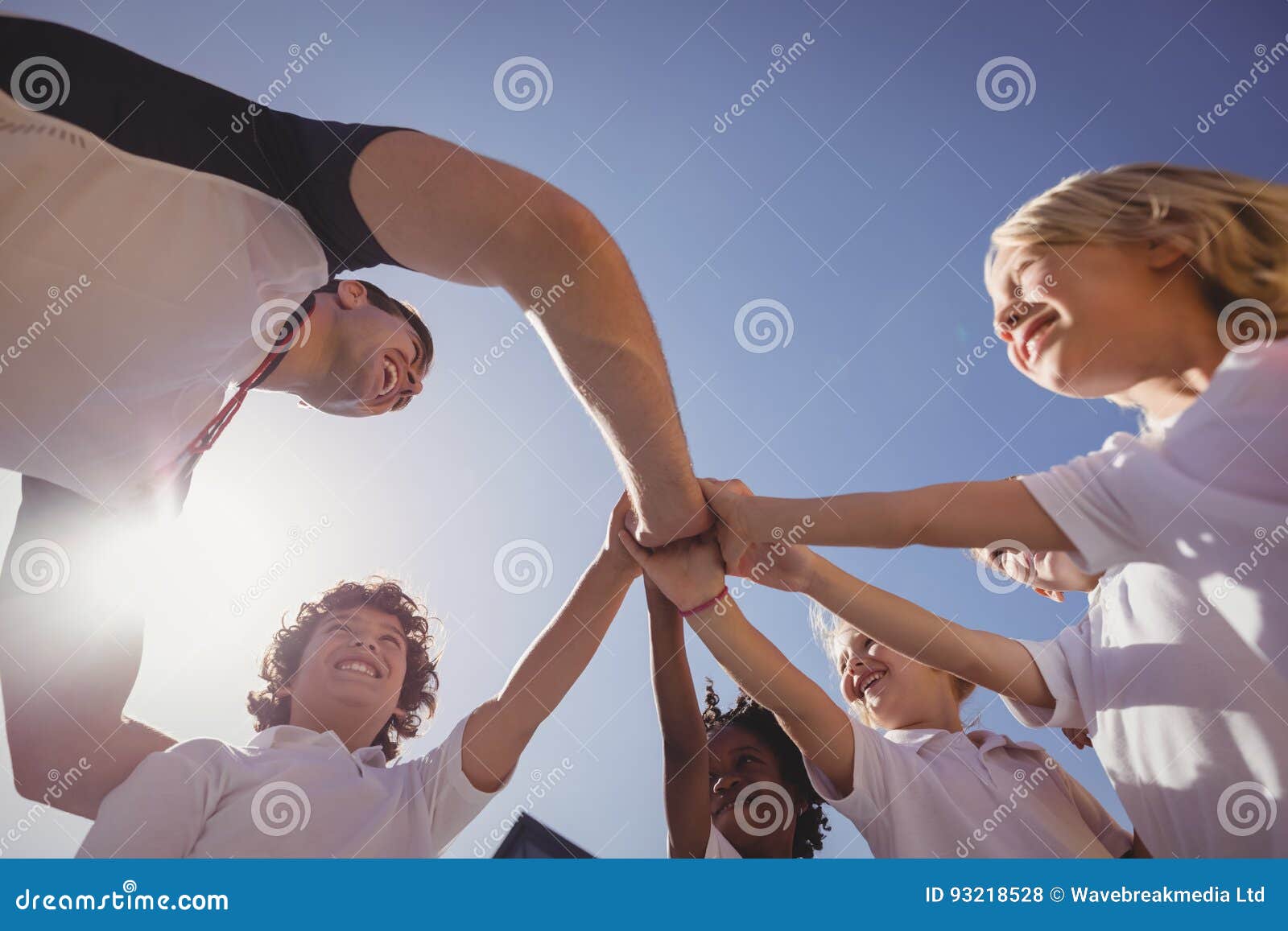 Happy Coach and Schoolkids Forming Handstack Stock Photo - Image of ...