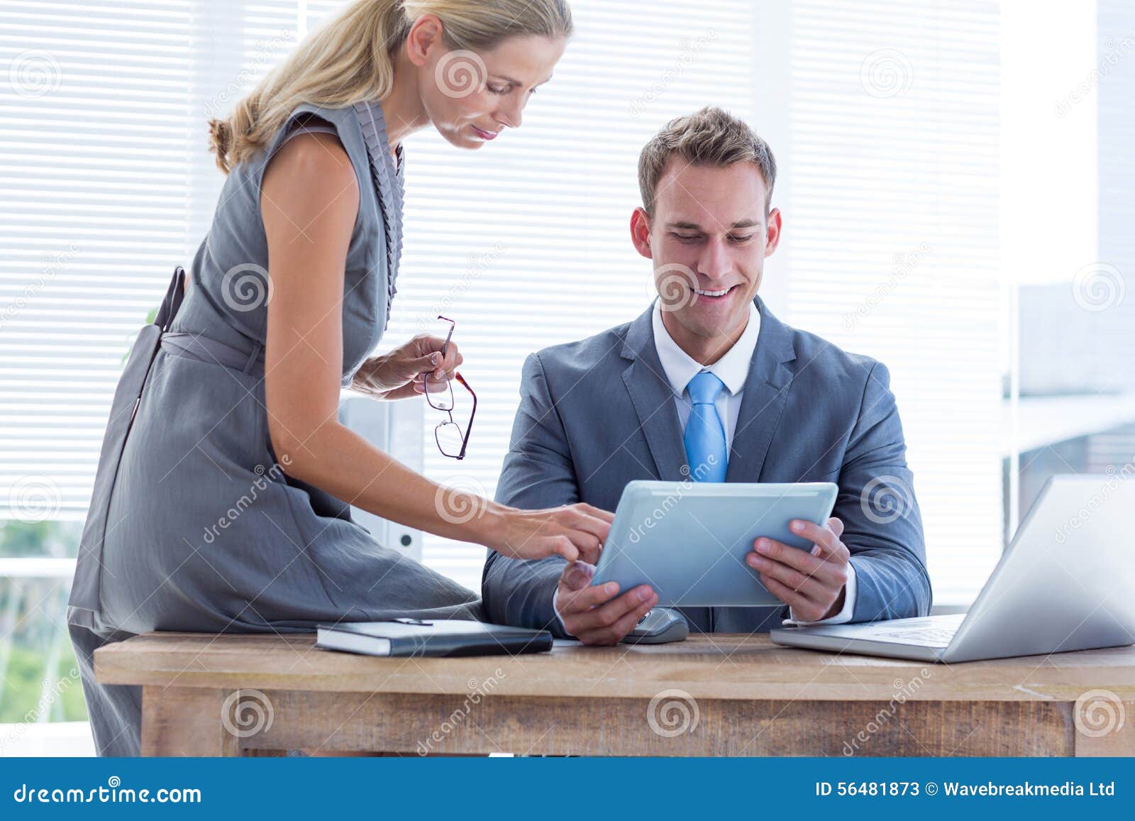 Happy Colleagues Working Together on Tablet Stock Image - Image of ...