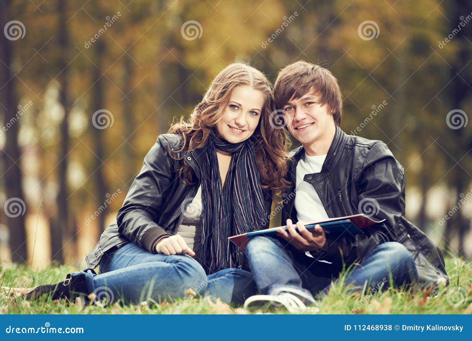 Happy College Students on Campus Lawn Outdoors Stock Photo - Image of ...