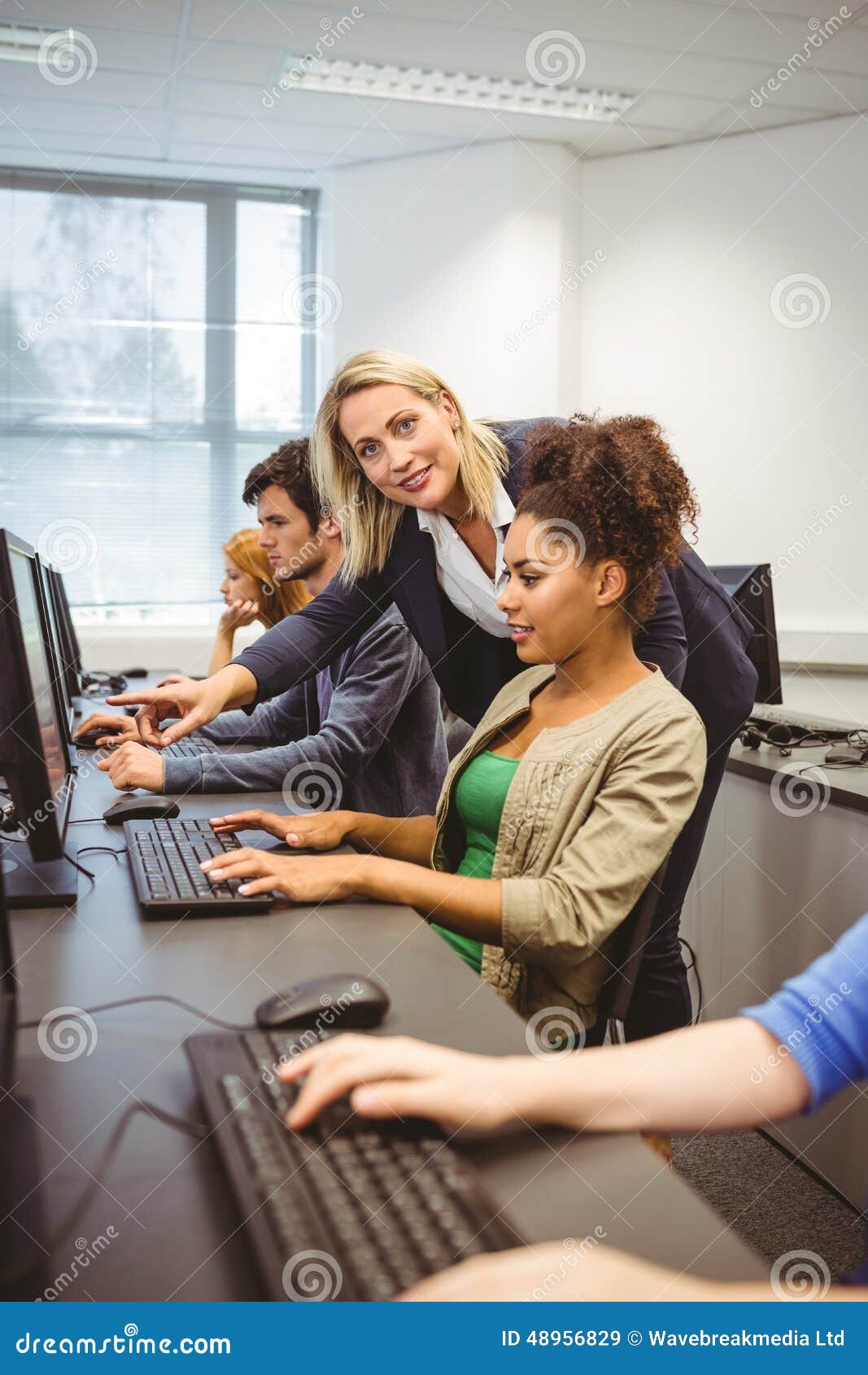 Happy Computer Teacher Smiling at Camera during Her Class Stock Image ...