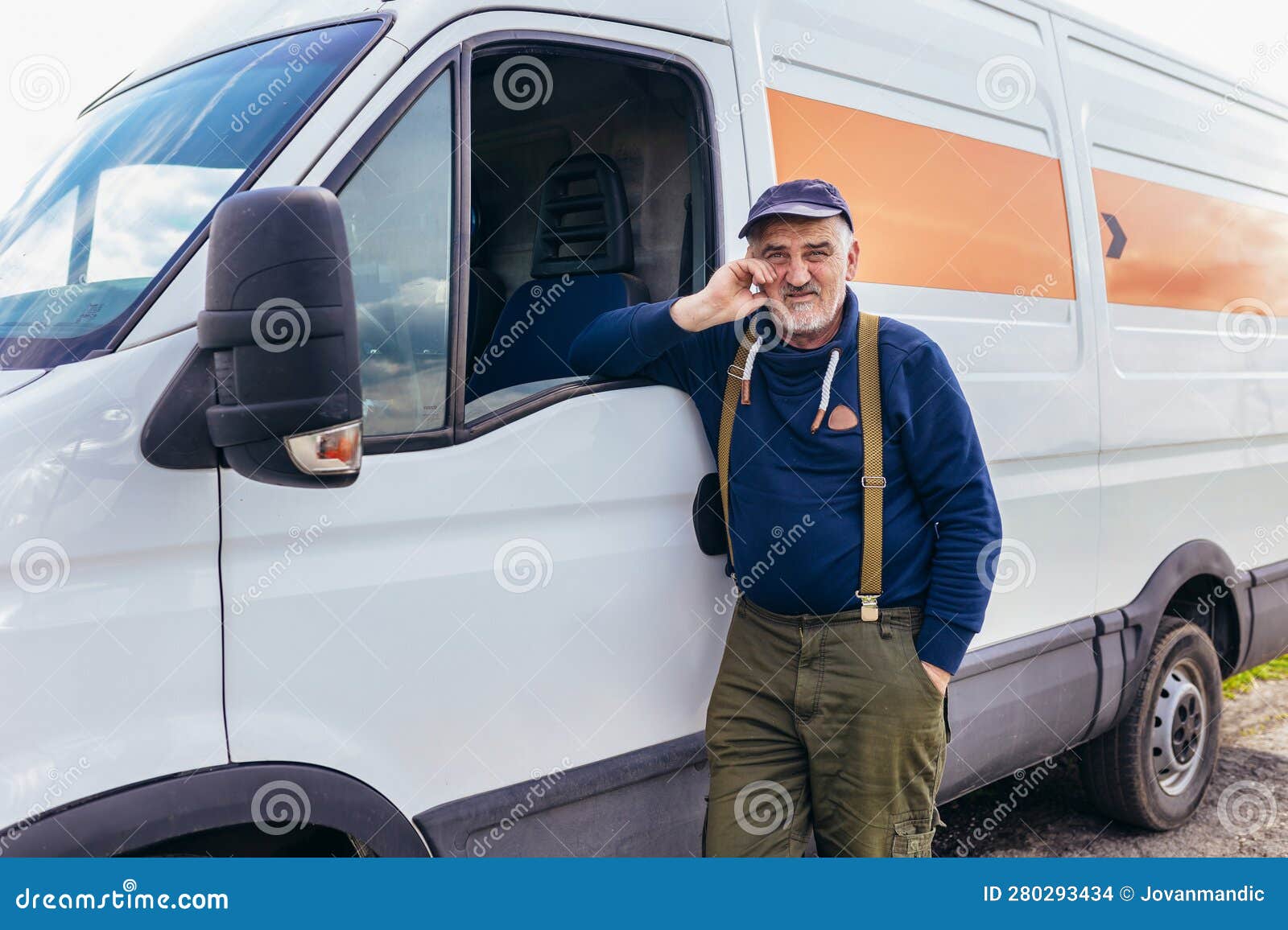 Confident Male Driver Standing in Front on His Van and Looking at ...