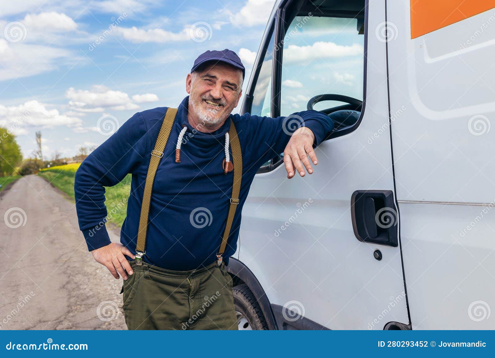 Confident Male Driver Standing in Front on His Van and Looking at ...