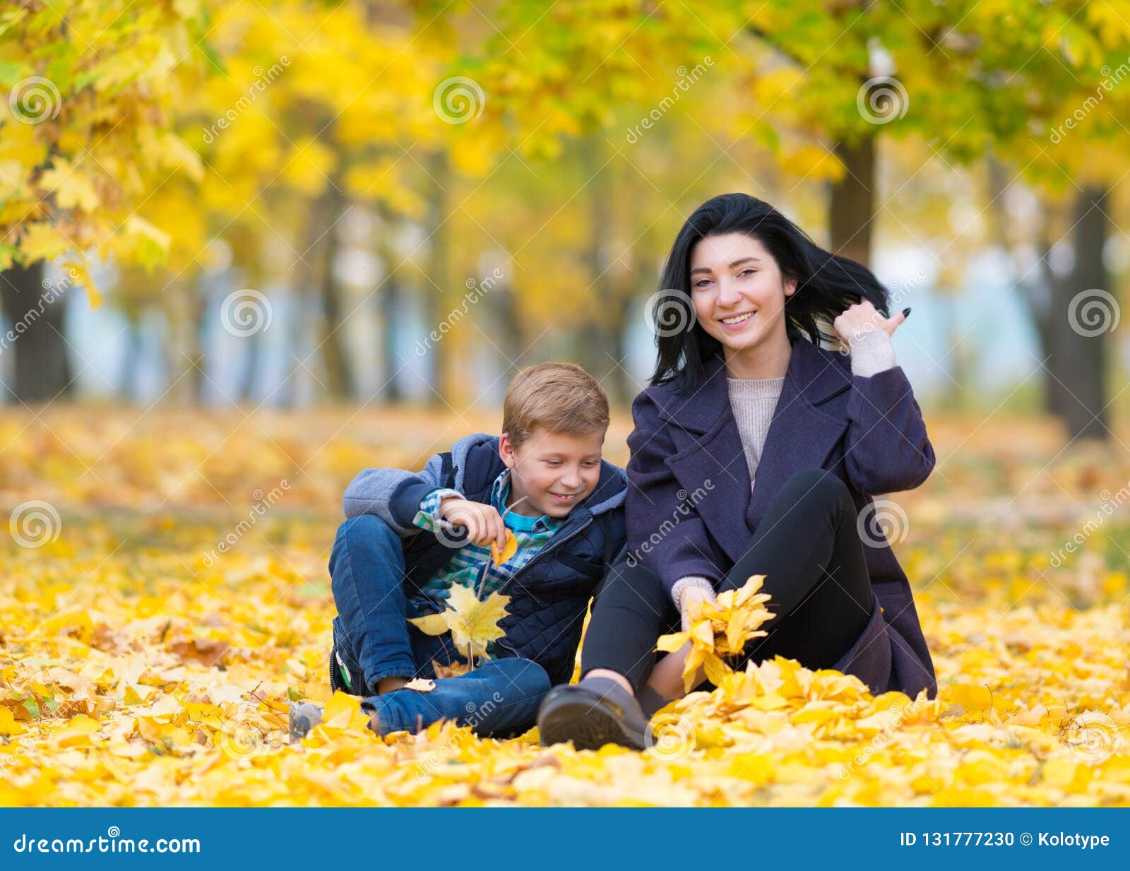 Happy, Content Mother and Son Playing in Park. Stock Photo - Image of ... Happy, Content Mother and Son Playing in Park. Stock Photo - Image of ...