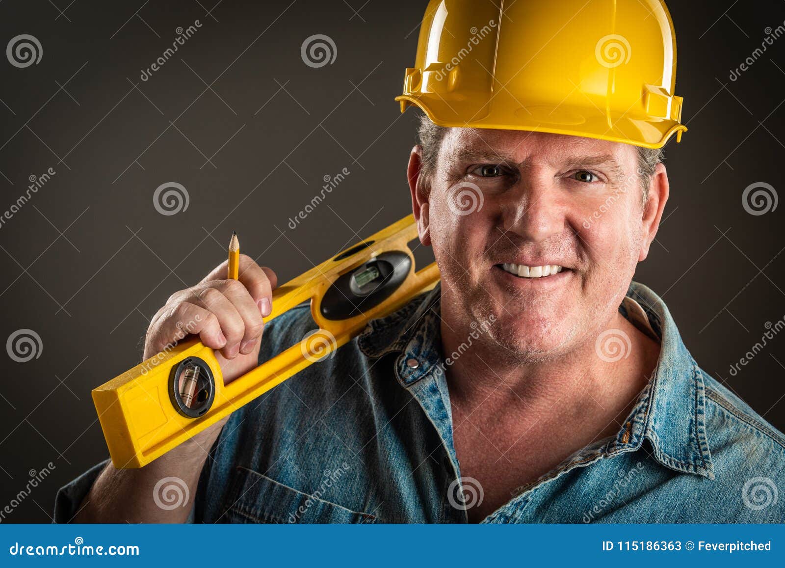 Happy Contractor in Hard Hat Holding Level and Pencil Stock Image ...