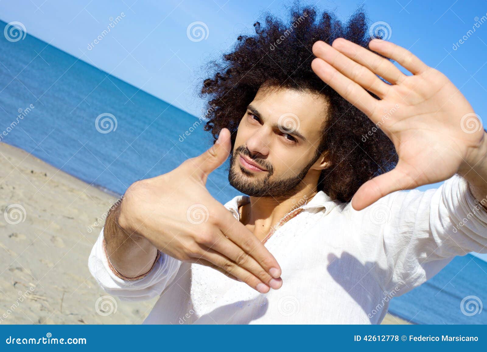 Happy Cool Man Playing with Camera on the Beach Posing Stock Photo ...