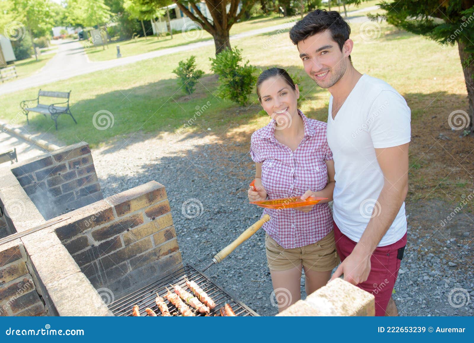 Happy couple at barbeque stock image. Image of couple - 222653239
