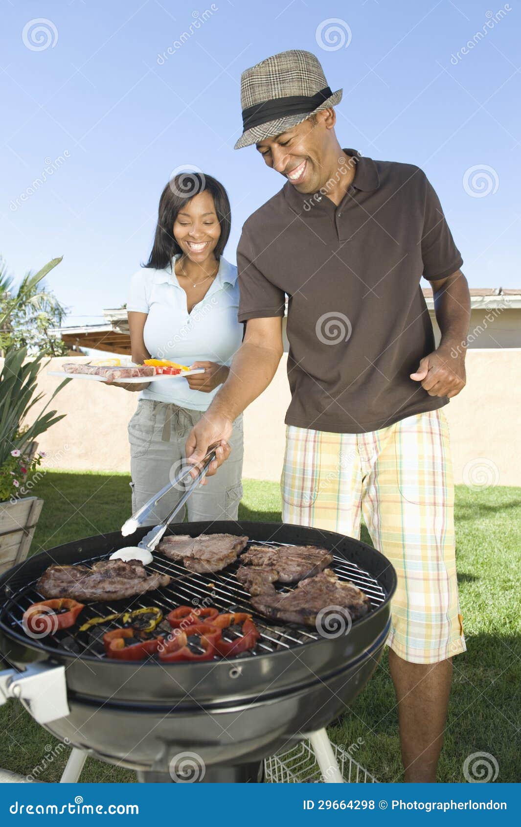 Happy Couple Barbequing stock photo. Image of cooking - 29664298