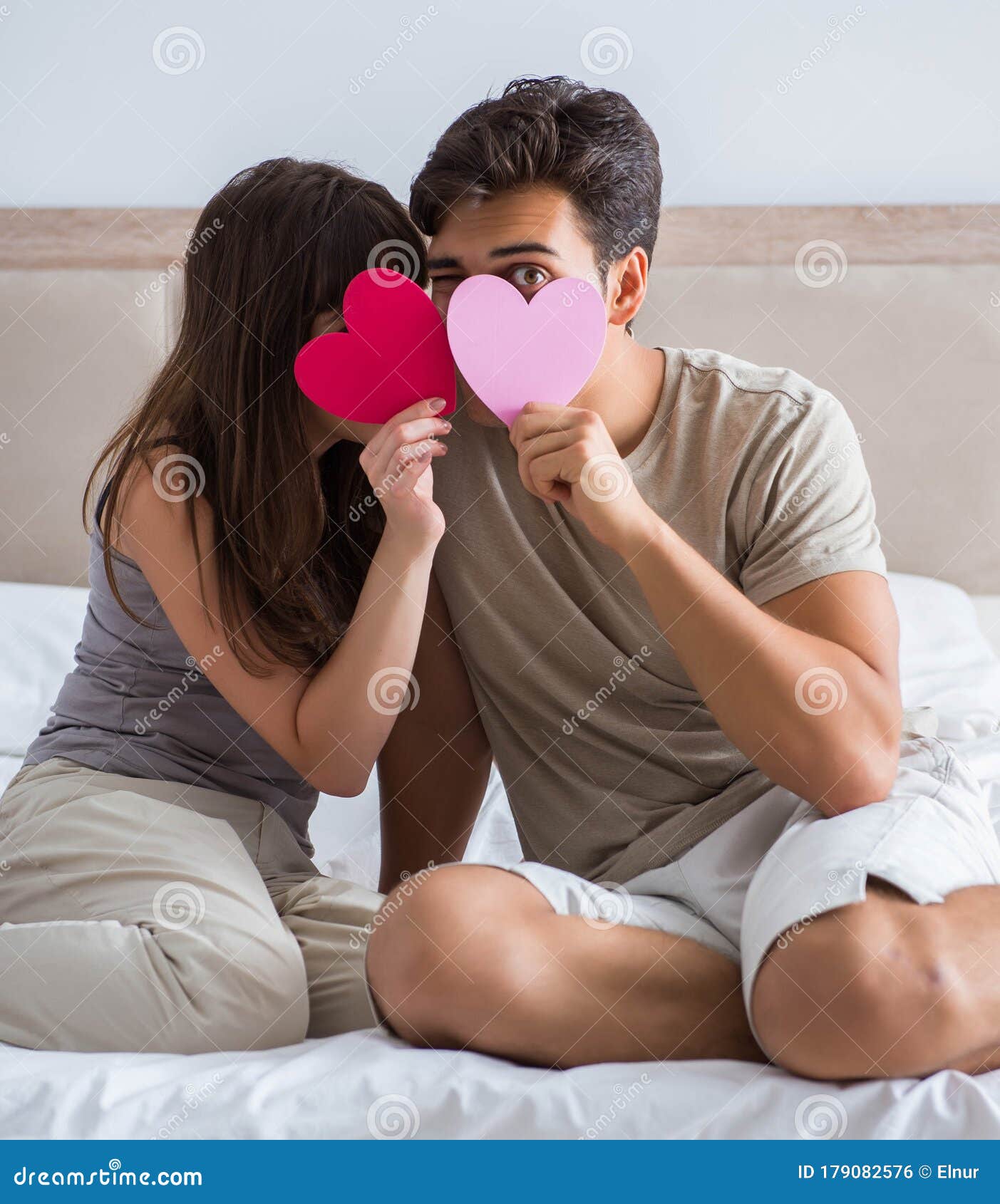 Happy couple in the bed stock photo. Image of home, family - 179082576