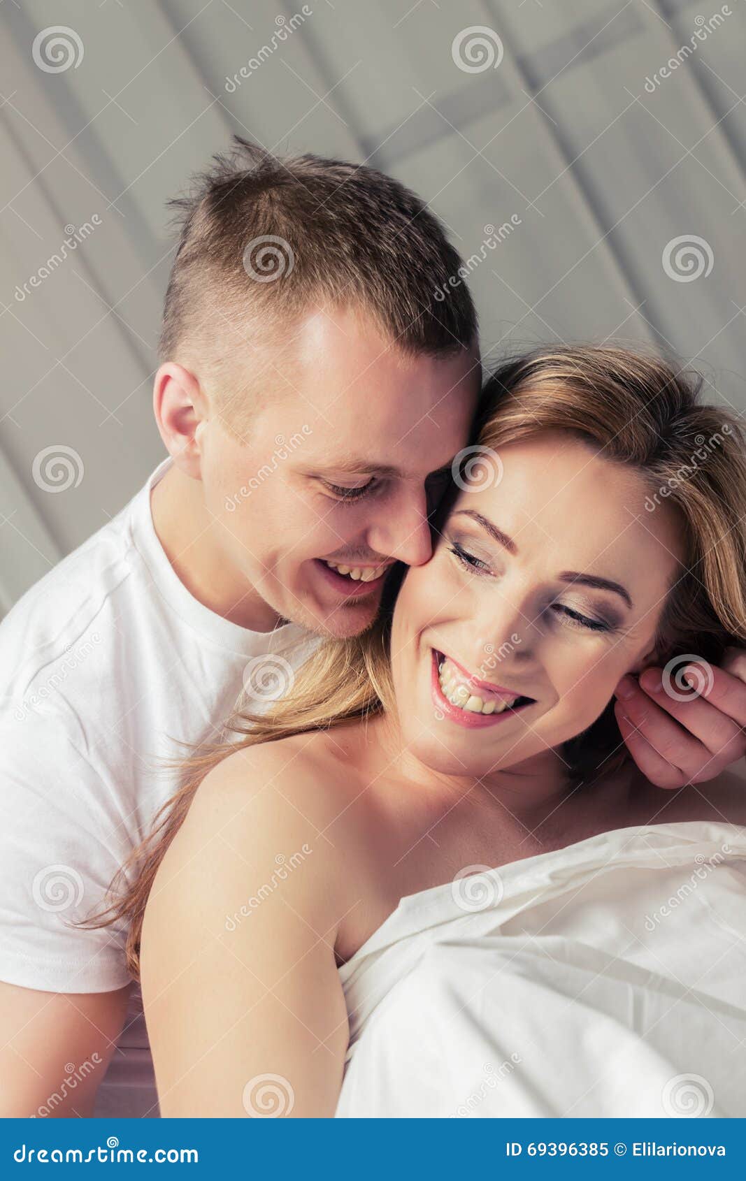 Happy couple in a bedroom. stock image. Image of everyday - 69396385