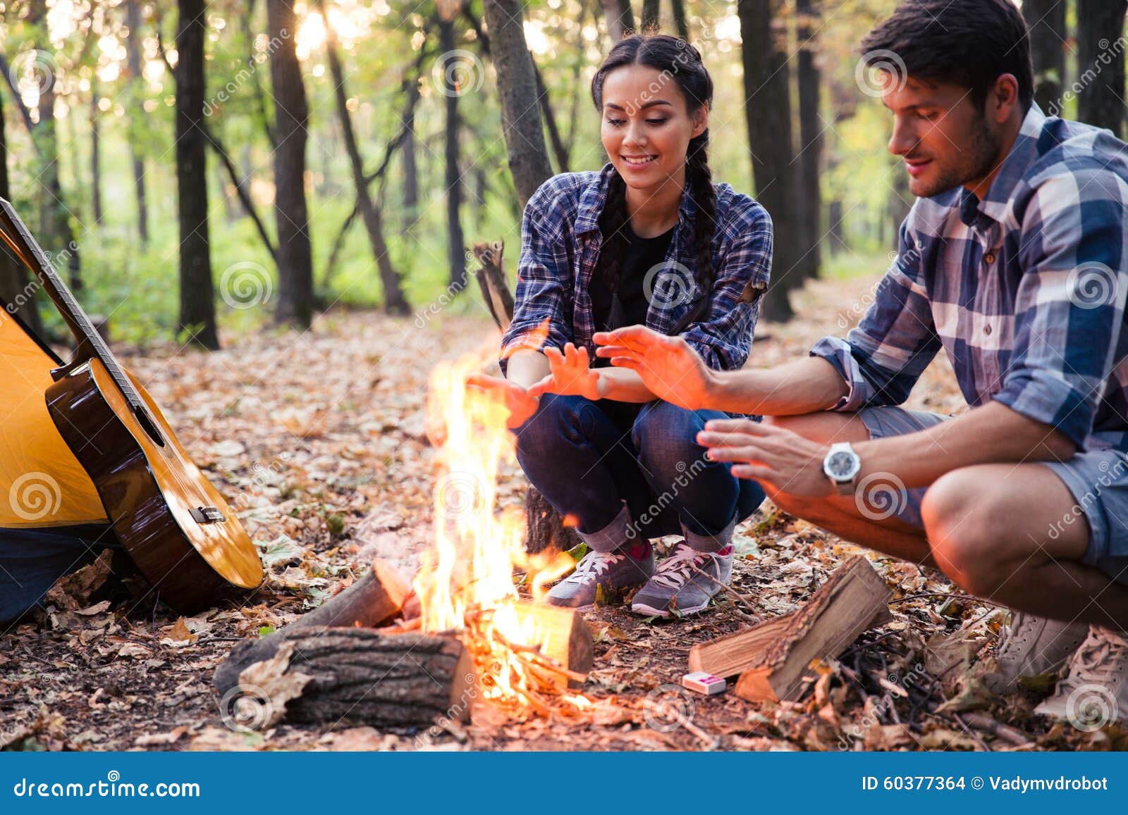 Happy couple and bonfire stock photo. Image of nature - 60377364