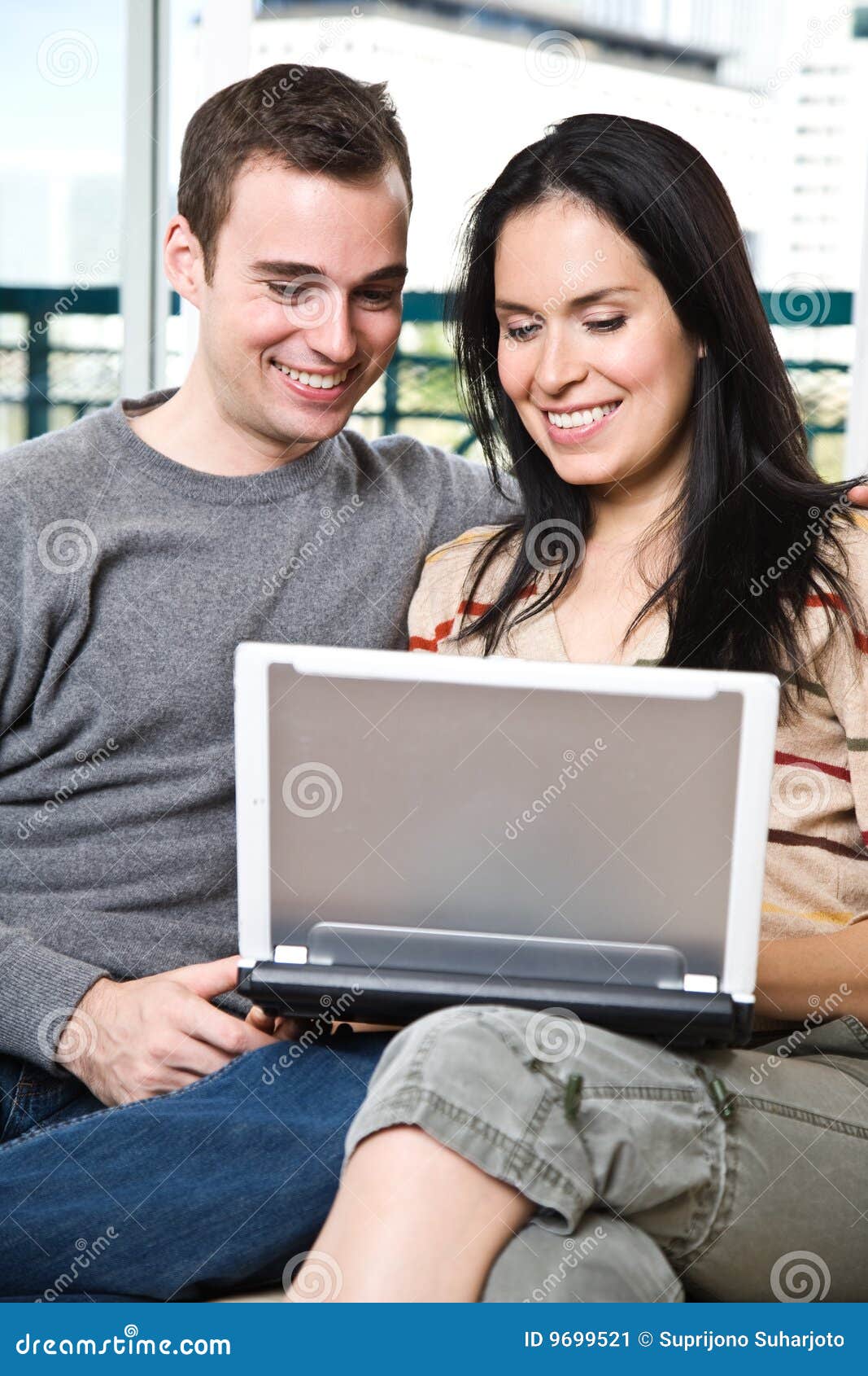 Happy Couple Browsing Internet at Home Stock Image - Image of ...
