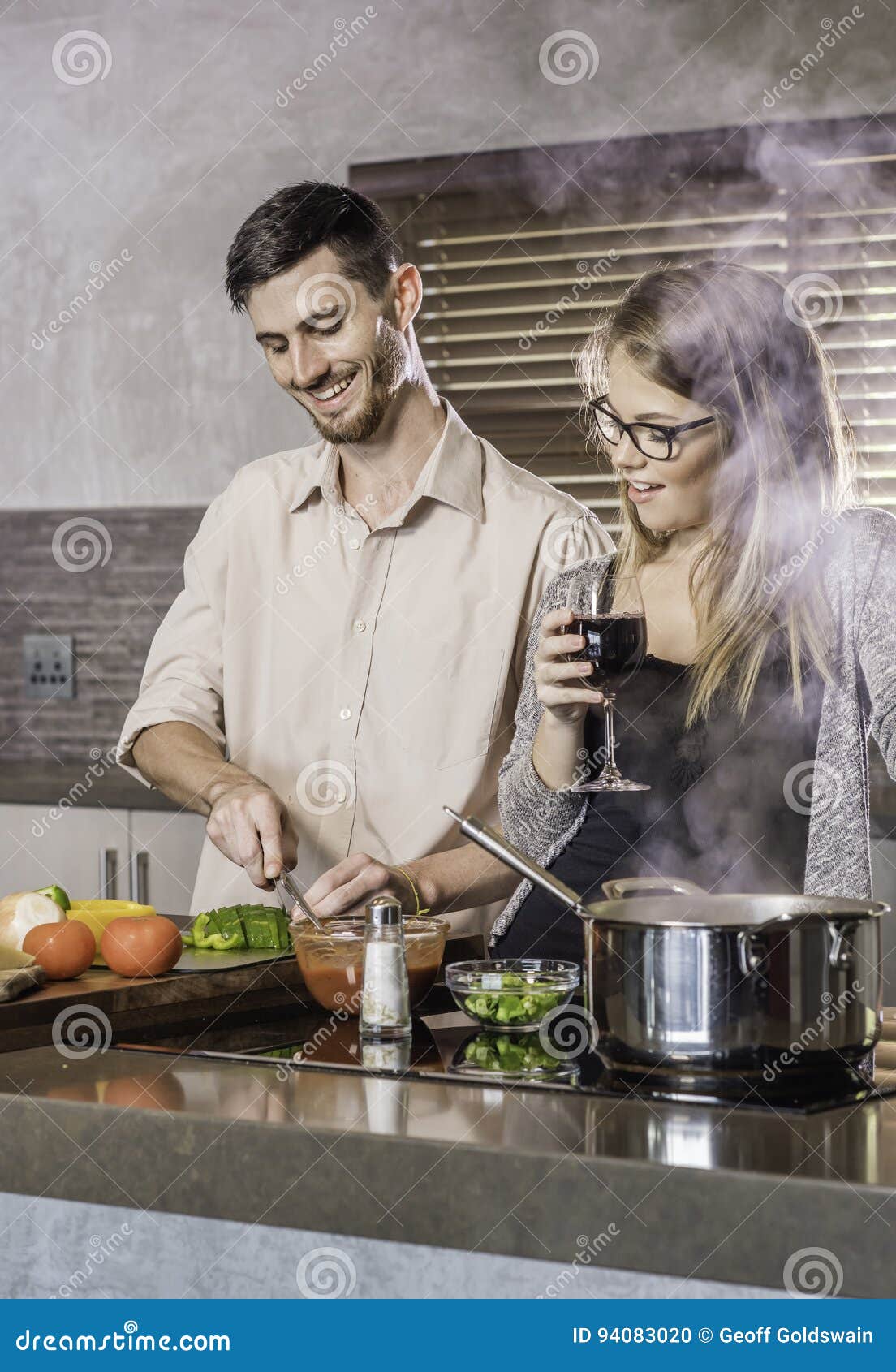 Happy Couple Chatting and Cooking a Meal in the Kitchen Flirting ...