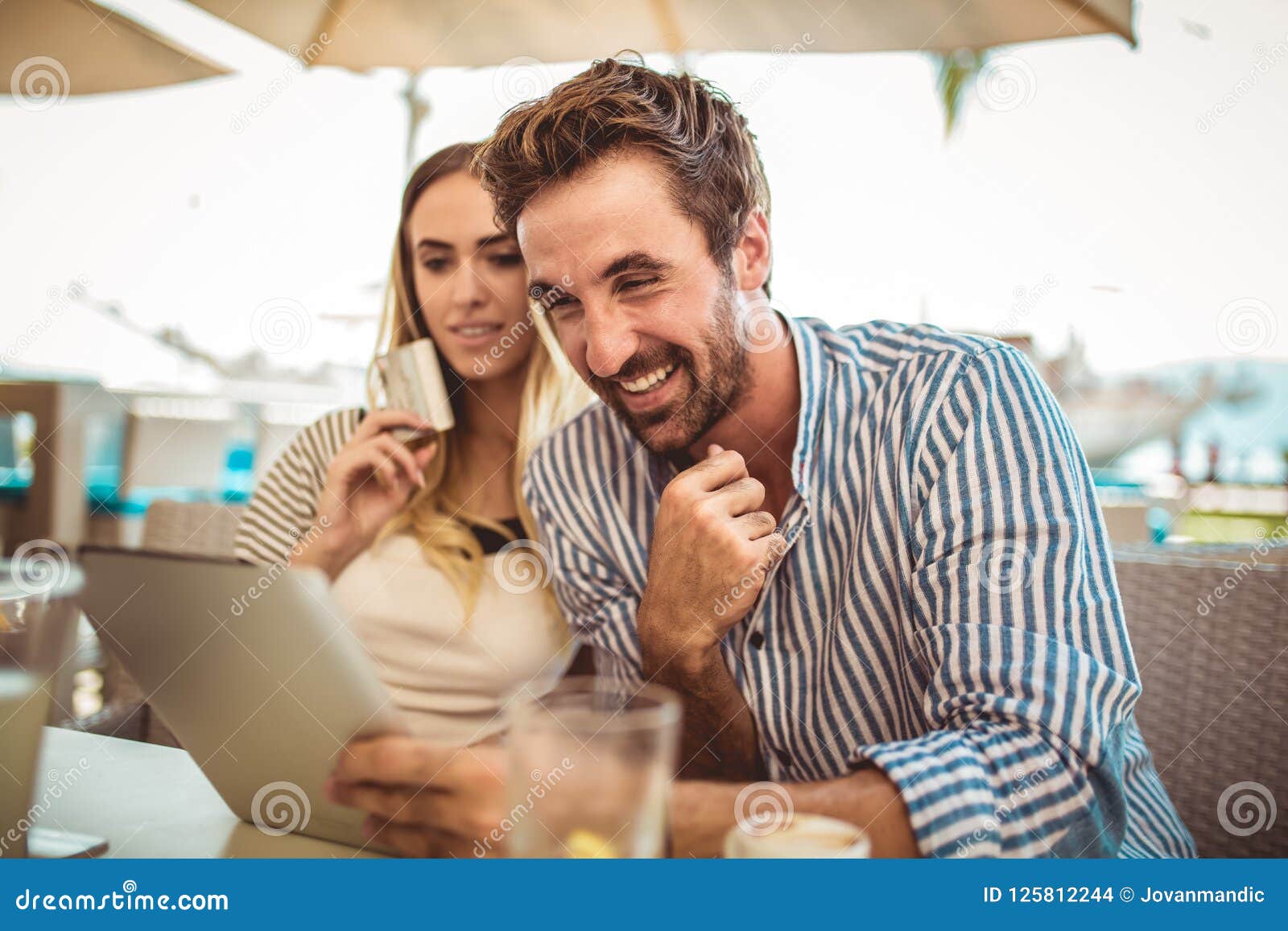 Couple Checking Menu at the Tablet Stock Photo - Image of outdoors ...