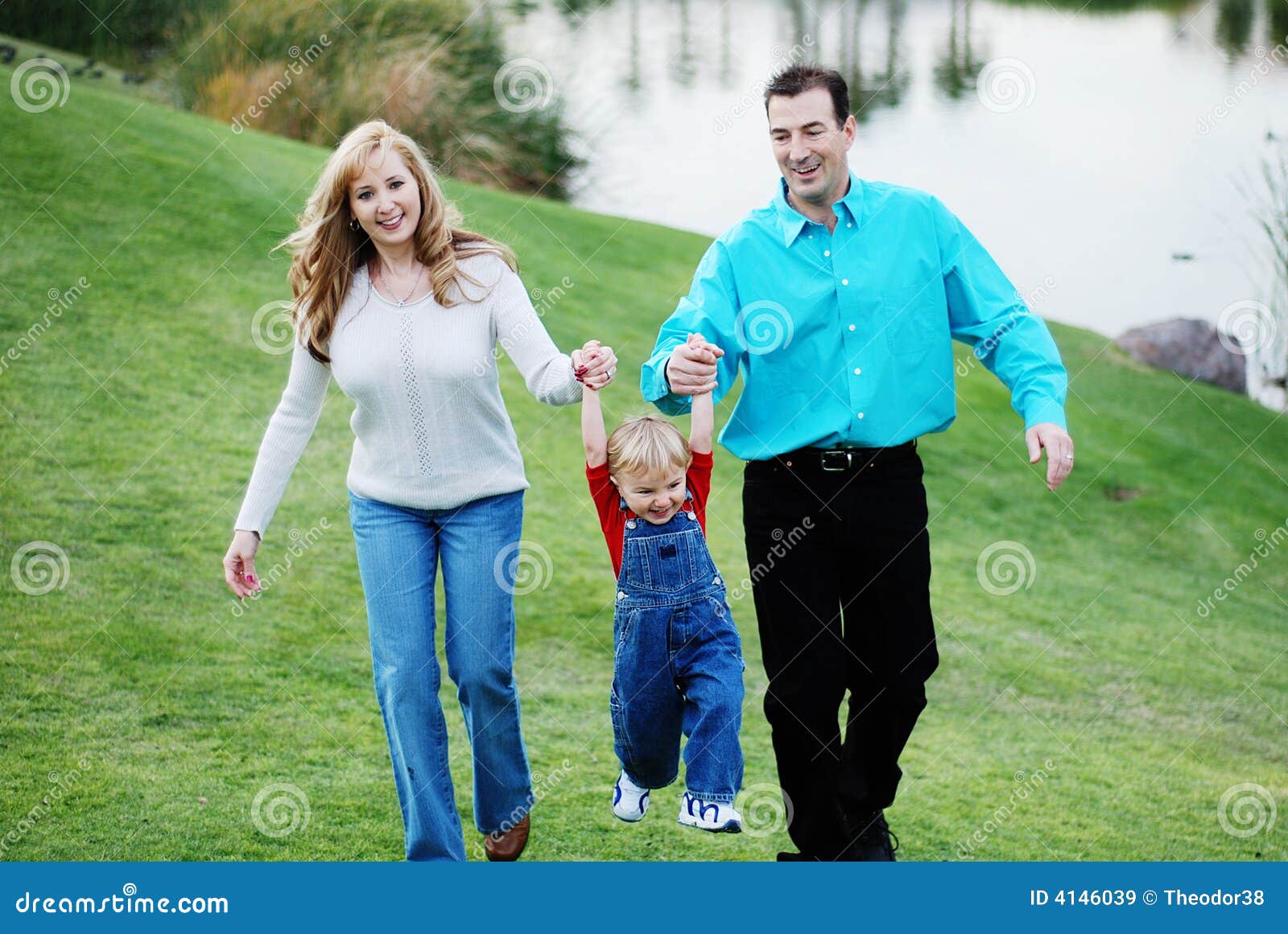 Happy couple with a child stock image. Image of cute, female - 4146039