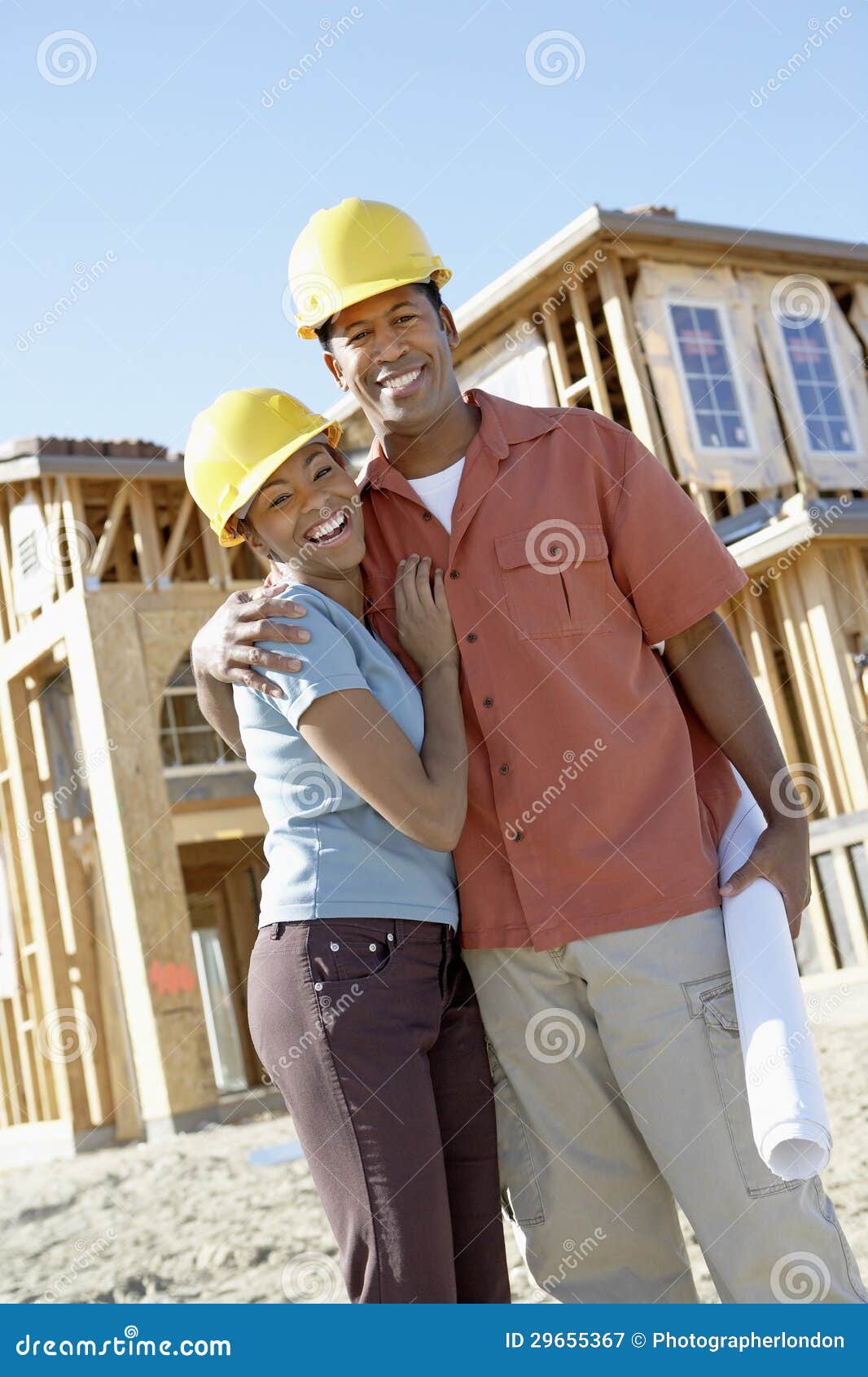 Happy Couple at Construction Site Stock Image - Image of blueprint ...