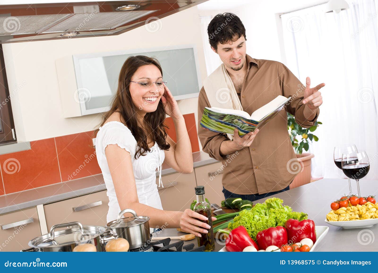 Happy Couple Cook in Kitchen with Cookbook Stock Image - Image of food ...