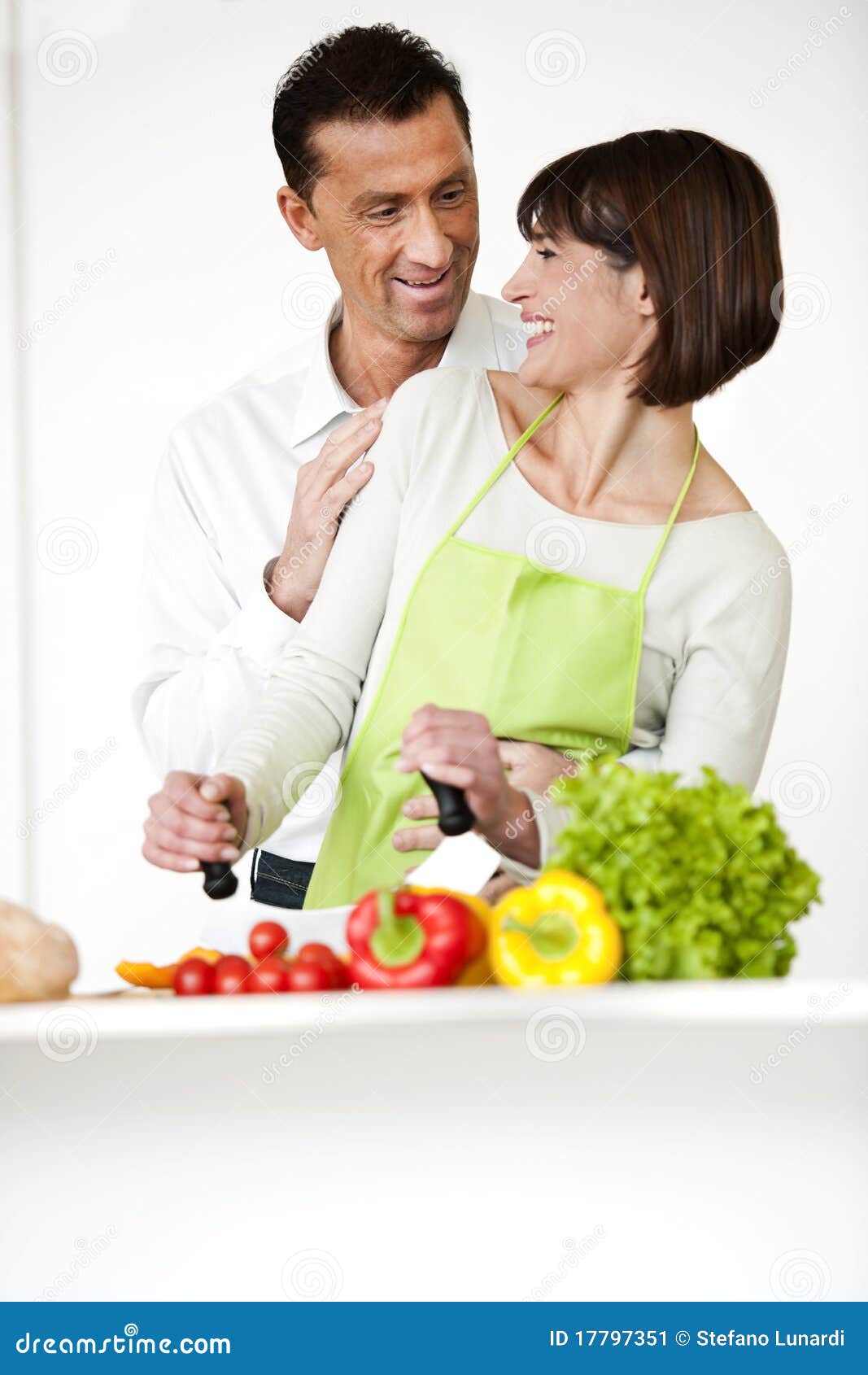 Happy Couple Cooking Together Stock Image - Image of hair, male: 17797351
