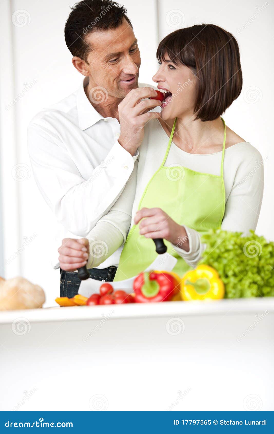 Happy Couple Cooking Together Stock Image - Image of green, color: 17797565