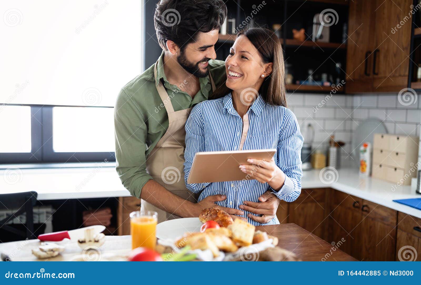 Happy Couple Cooking Together in Their Kitchen Stock Image - Image of ...