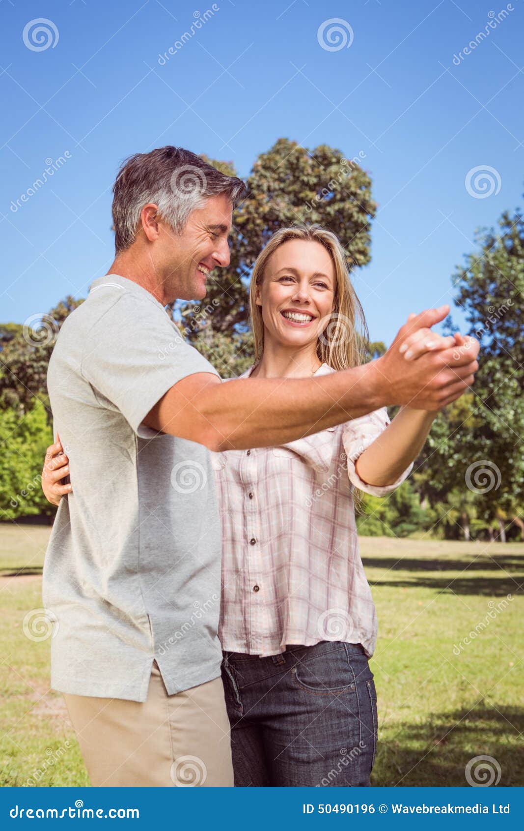 Happy Couple Dancing in the Park Stock Photo - Image of dancing, female ...