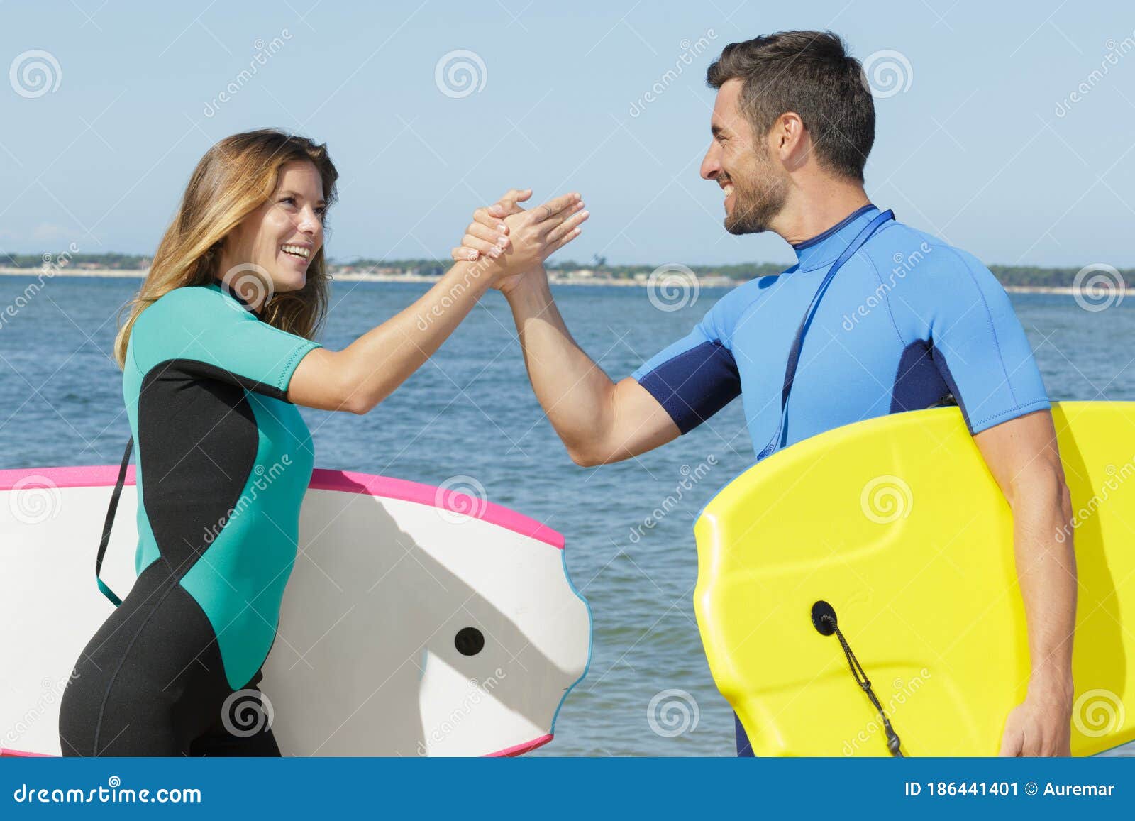 Happy Couple Doing High Five after Doing Bodyboard Stock Image - Image ...